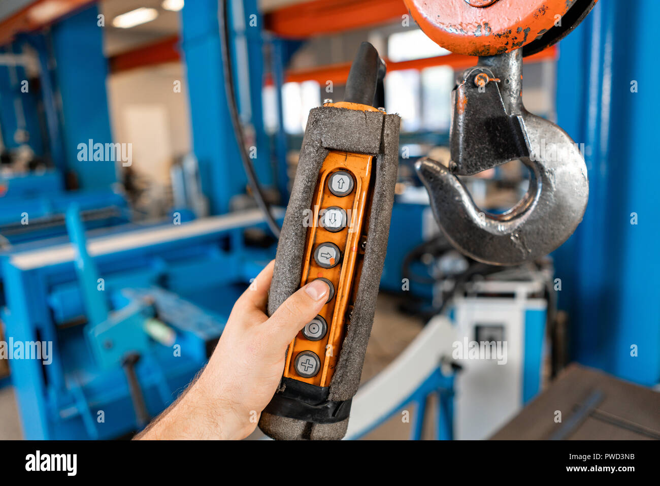 remote control of the crane on production. Workers working with a crane ...