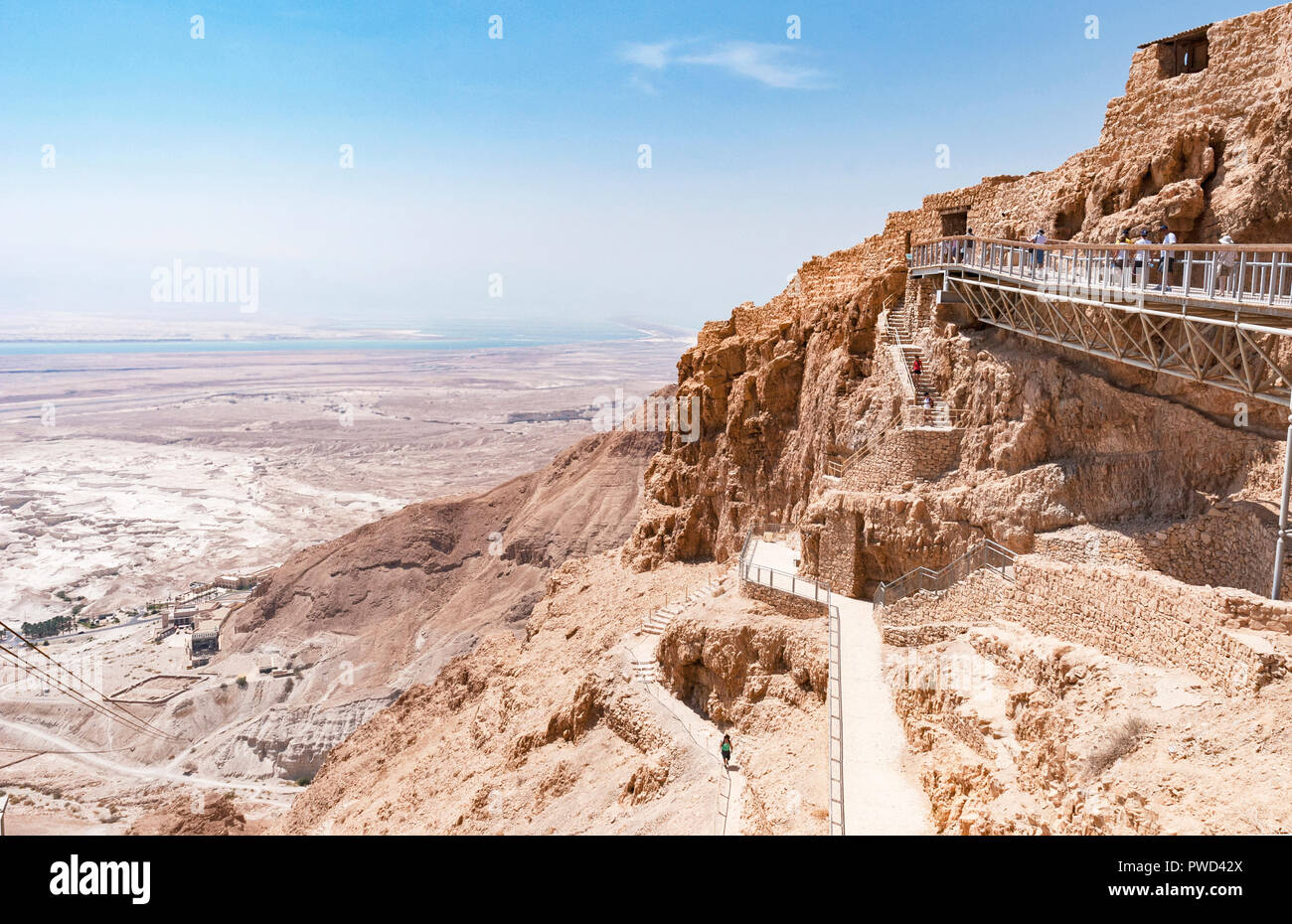 tourists at the main entrance of the ancient Masada fortress showing ...