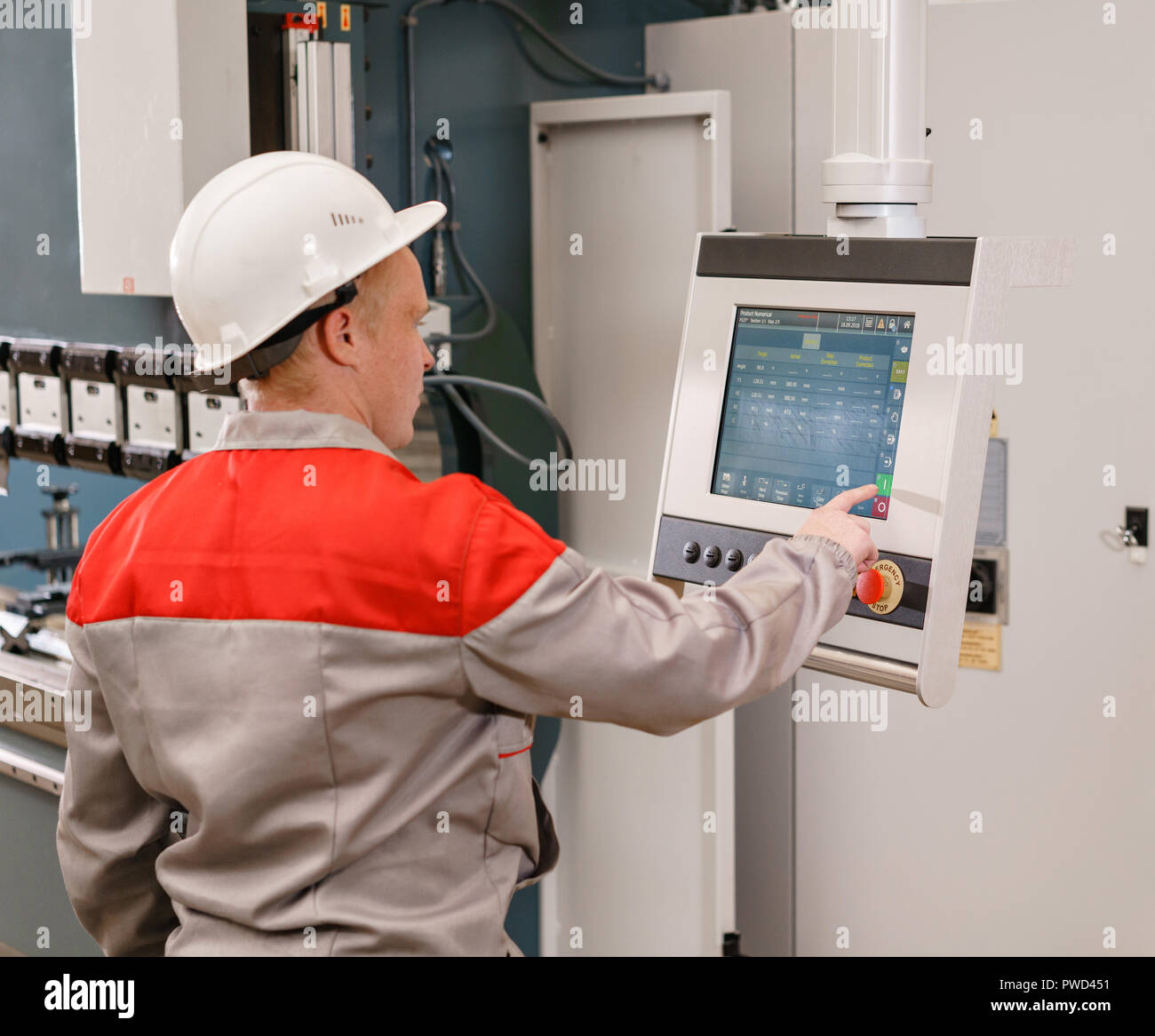 control computer display of Machine. Manufacture workers adjusts the ...