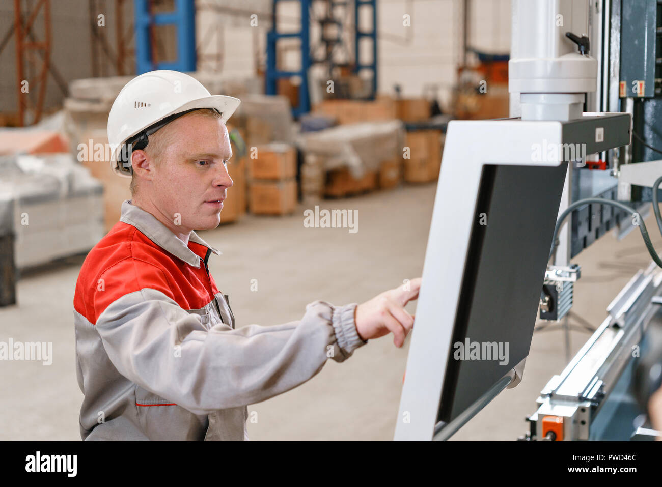 control computer display of Machine. Manufacture workers adjusts the ...