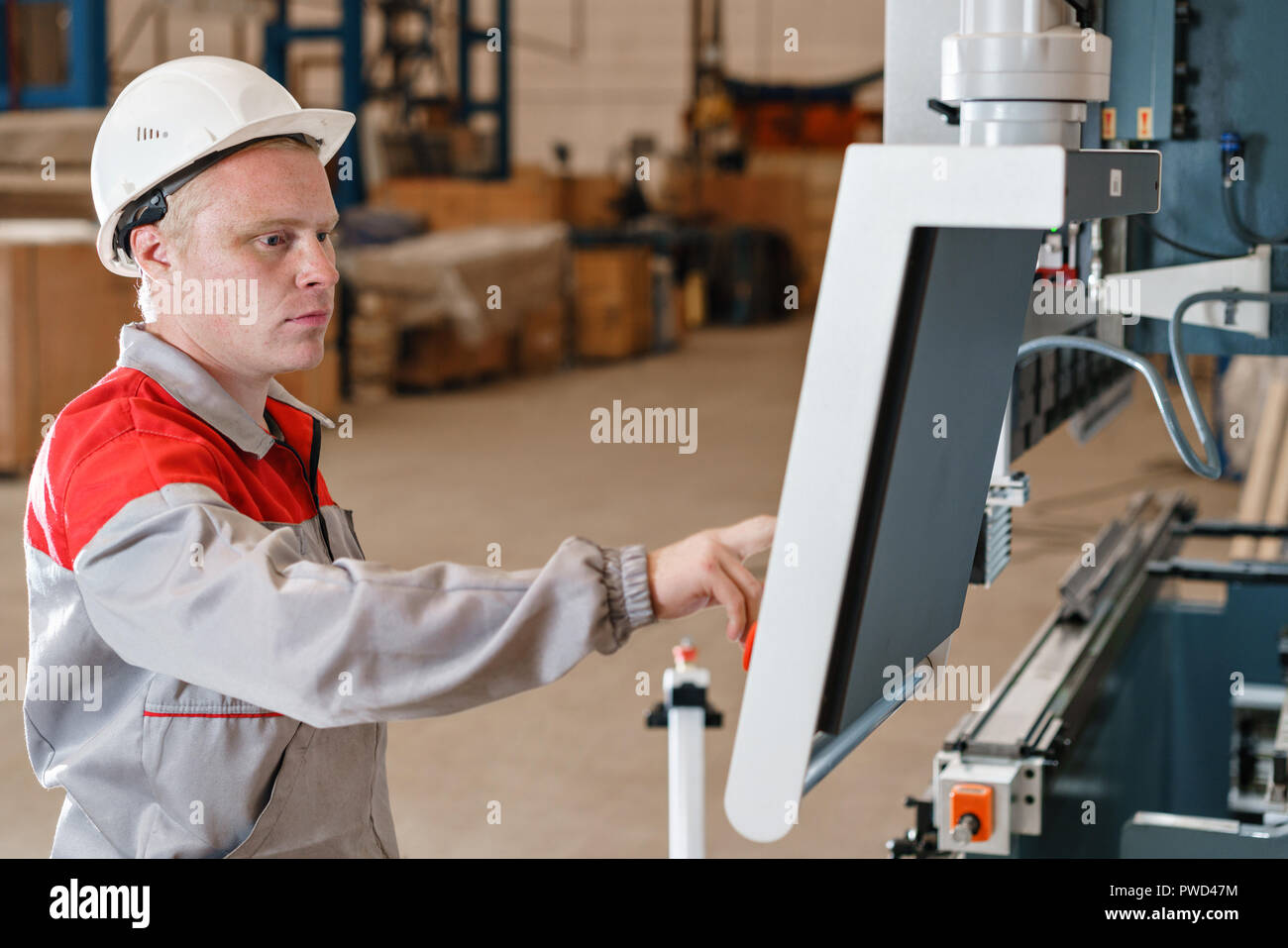 control computer display of Machine. Manufacture workers adjusts the ...