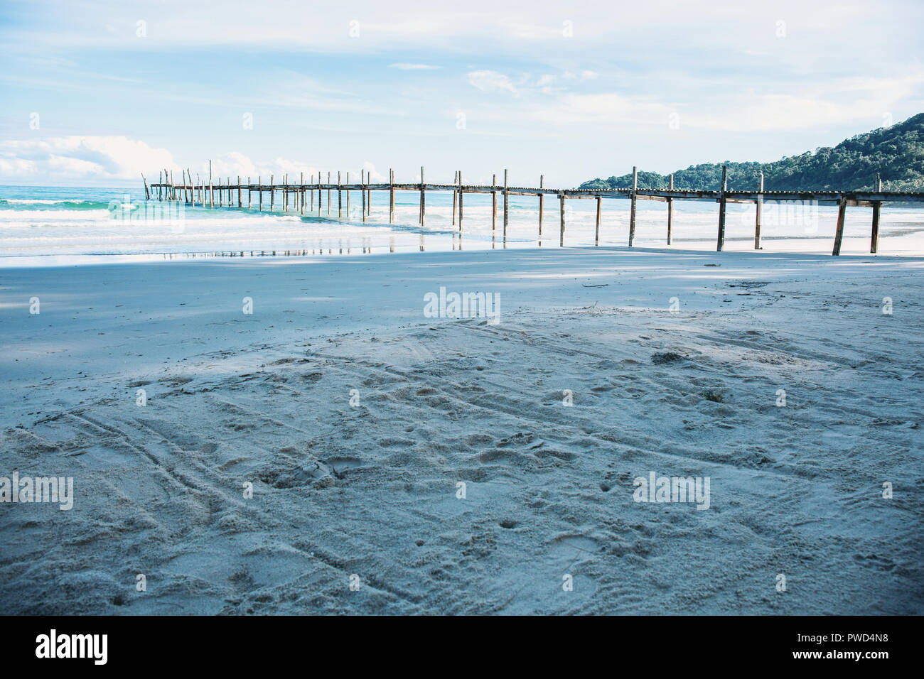 Wooden bridge on the beach with beautiful at sky Stock Photo - Alamy