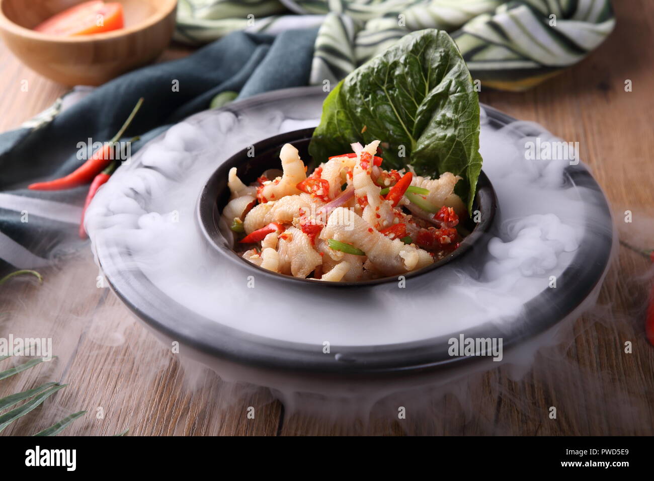 Hot and sour chicken feet Stock Photo - Alamy