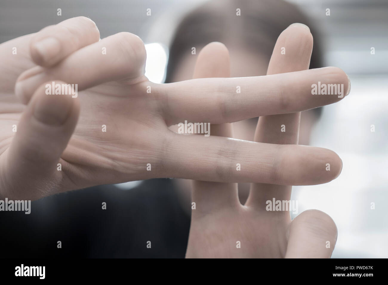 hand gesture denoting a prison lattice Stock Photo - Alamy