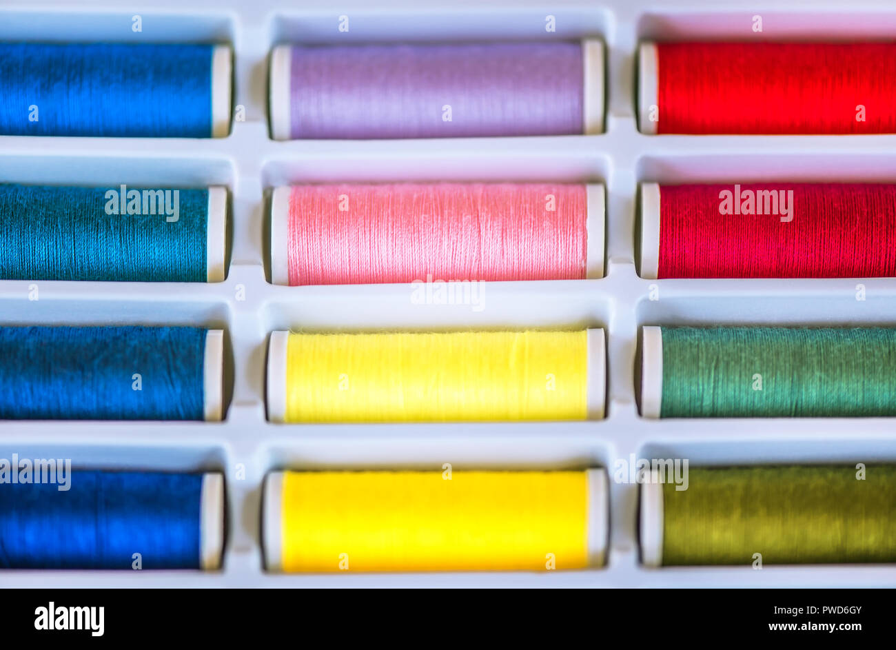 Spools with different color and tones threads Stock Photo - Alamy