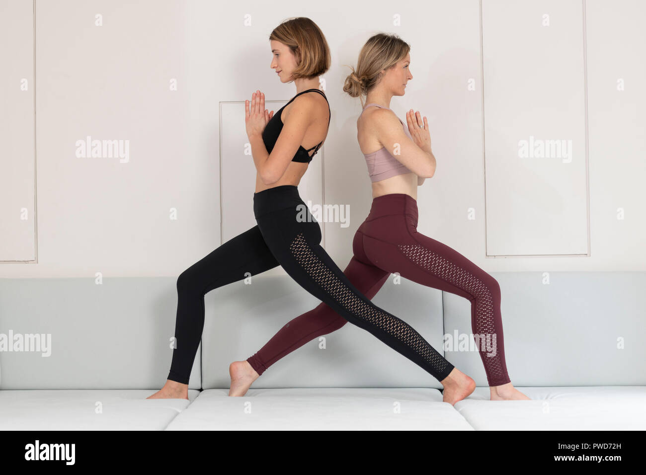 two women practicing yoga together, acro yoga Stock Photo - Alamy