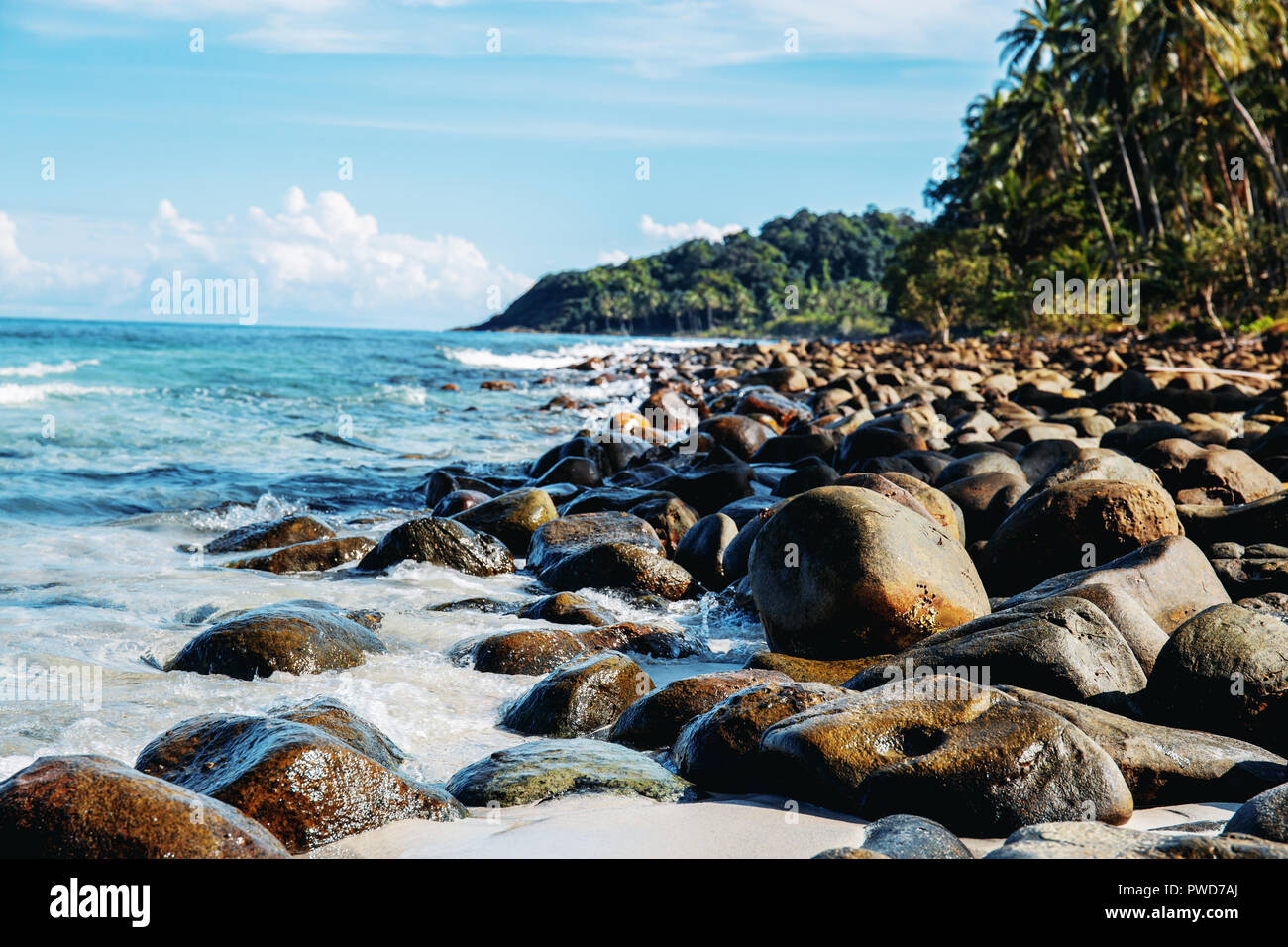 Rocks on shore at the sea with sky Stock Photo - Alamy