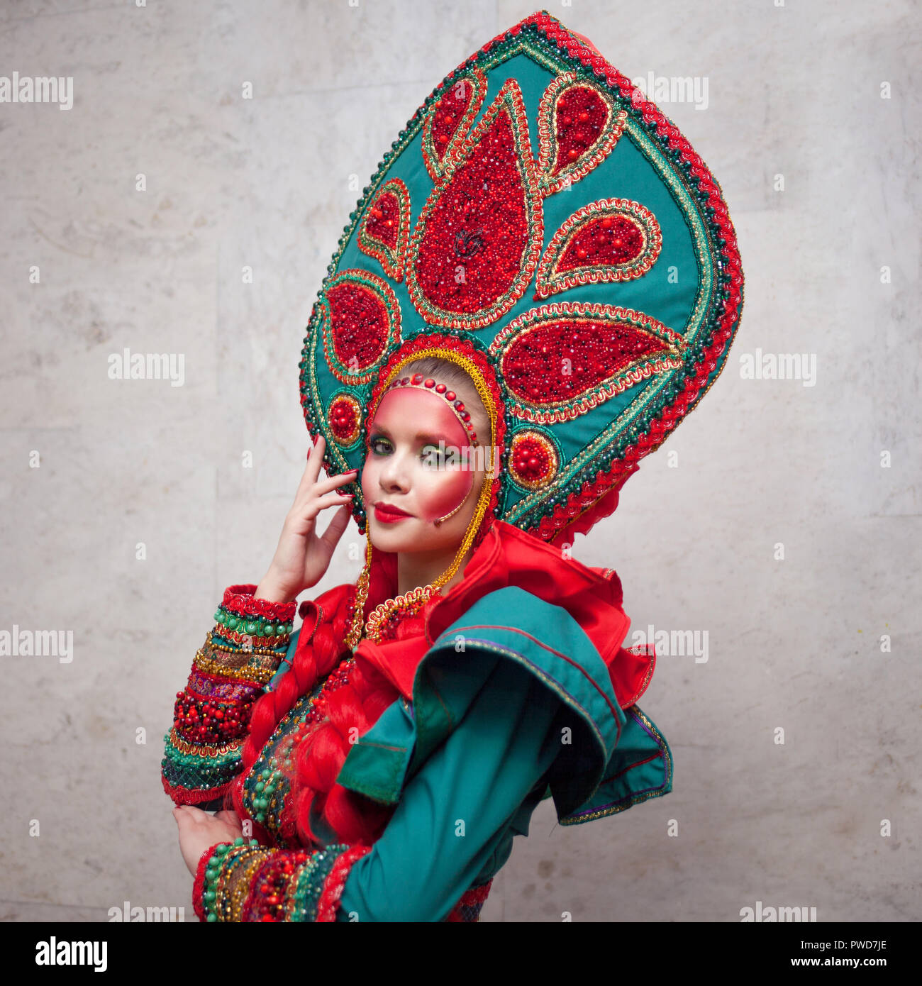 Girl in a headdress. Portrait of a beautiful young woman in a stylized ...