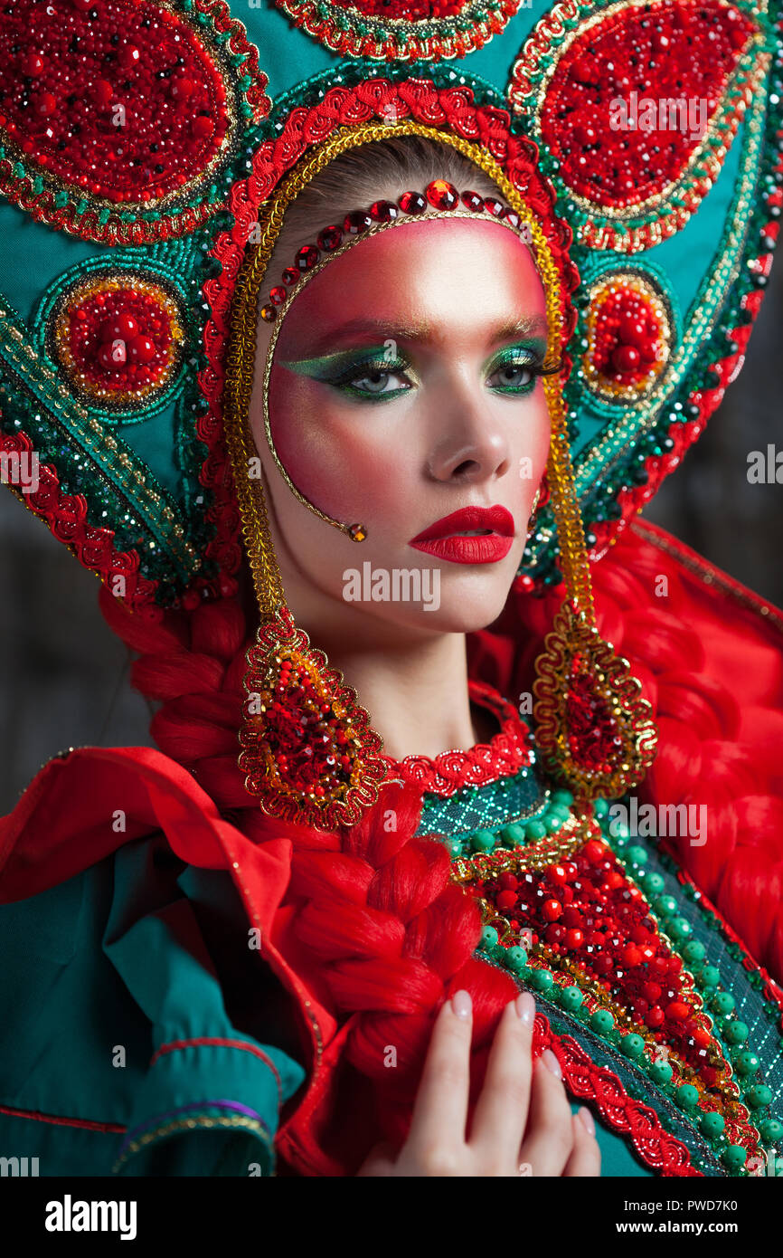 Girl in a headdress. Portrait of a beautiful young woman in a stylized ...