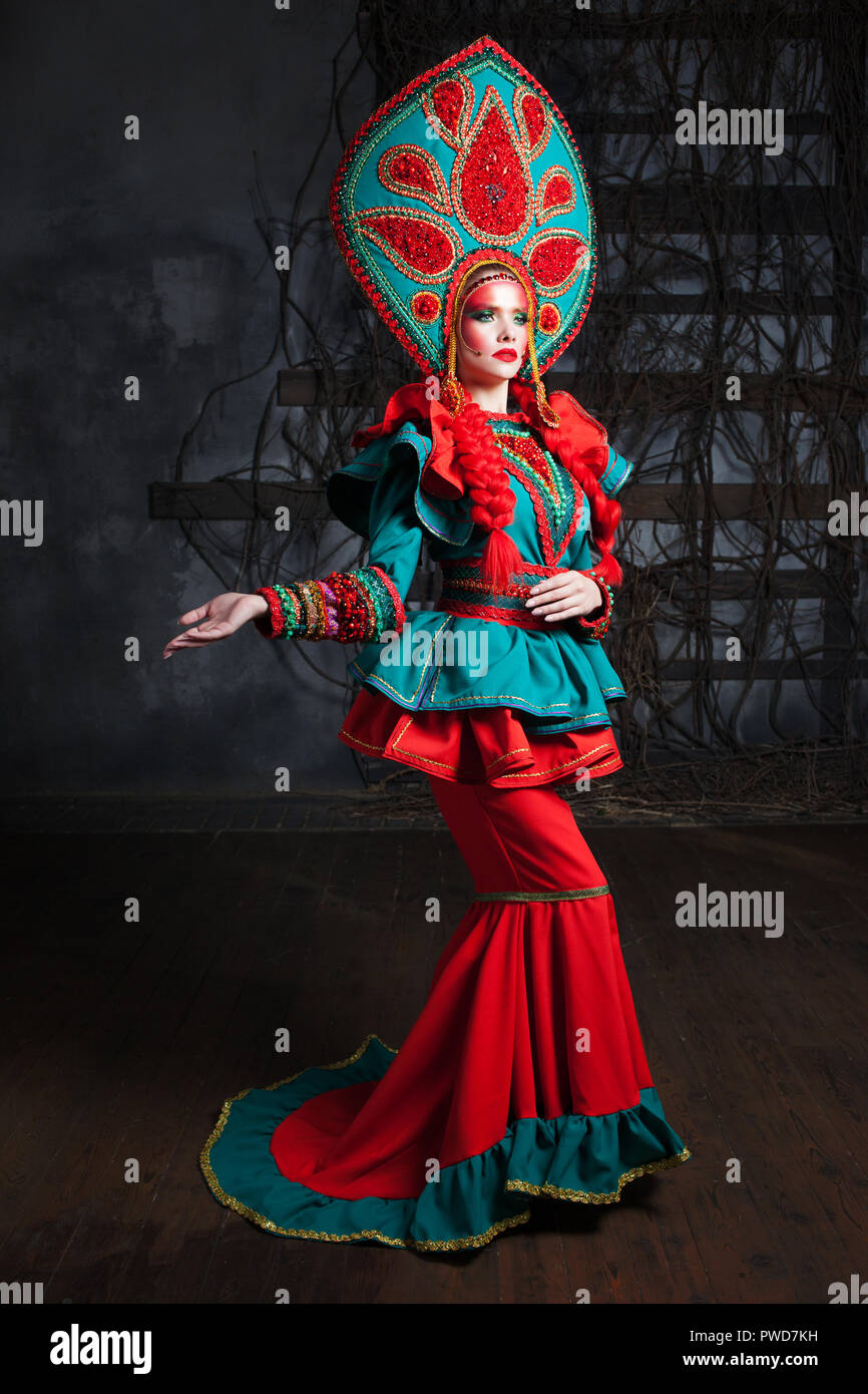 Girl in a headdress. Portrait of a beautiful young woman in a stylized ...