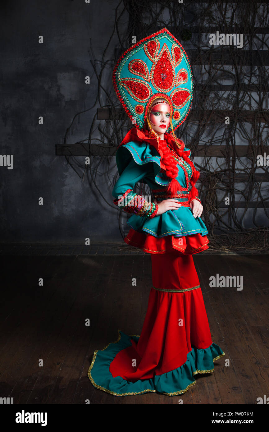 Girl in a headdress. Portrait of a beautiful young woman in a stylized ...