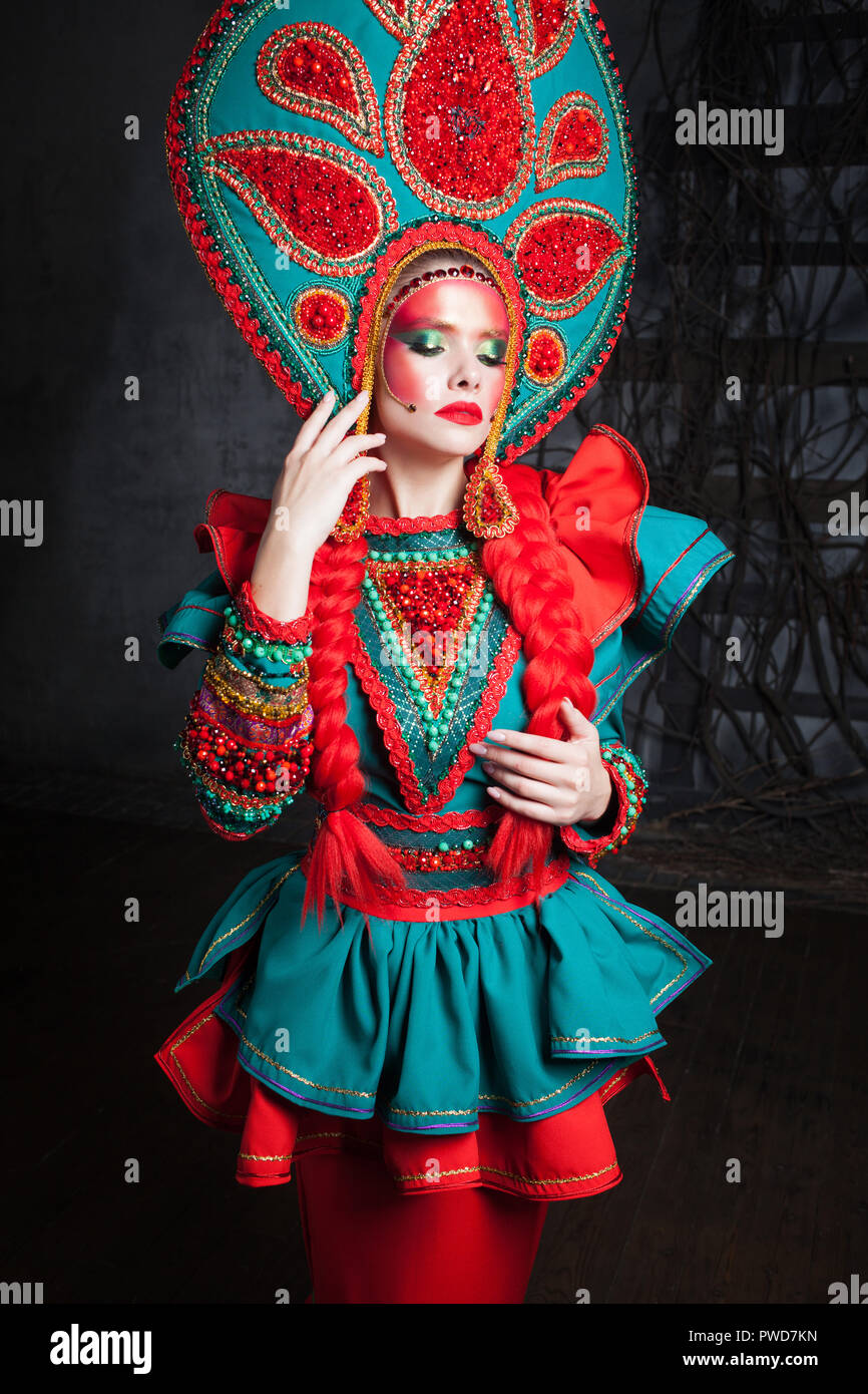 Girl in a headdress. Portrait of a beautiful young woman in a stylized ...