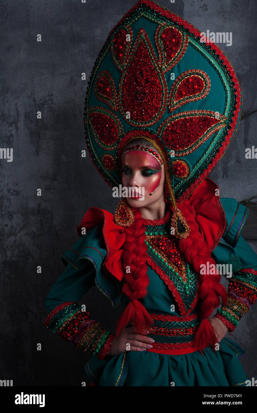 Girl in a headdress. Portrait of a beautiful young woman in a stylized ...