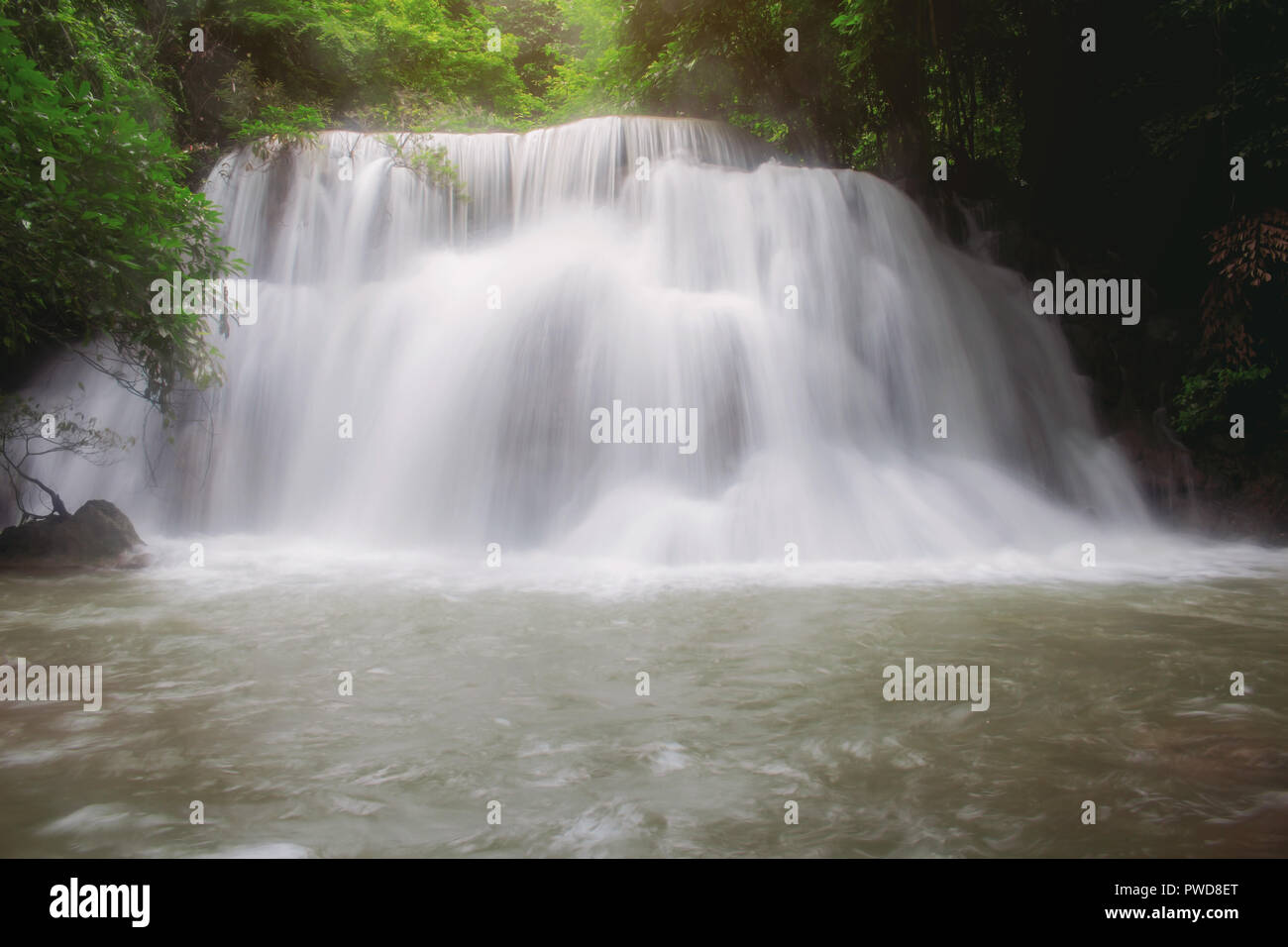 Waterfall in forest with beautiful at the sunrise Stock Photo - Alamy