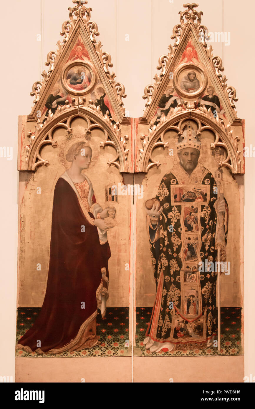 St Mary Magdalene and St Nicholas of Bari make up the left compartment ...