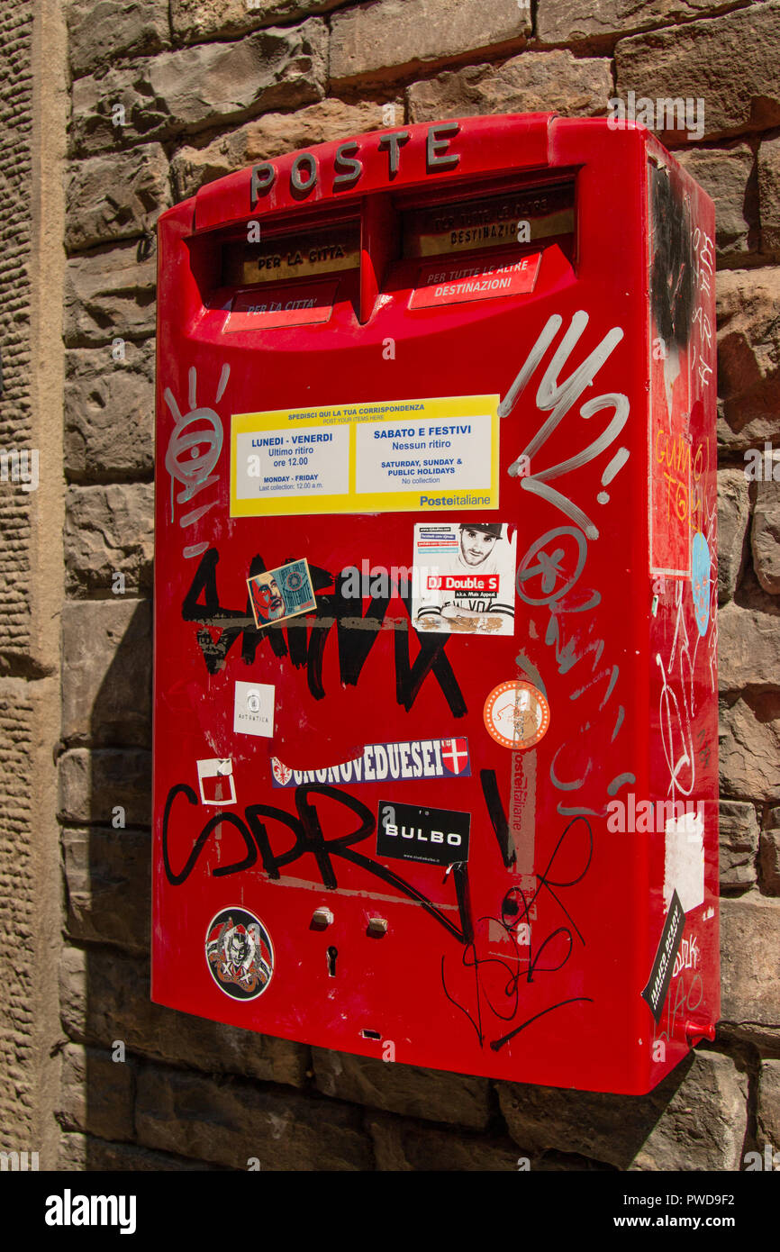 A red post box covered in graffiti in Florence, Italy Stock Photo - Alamy