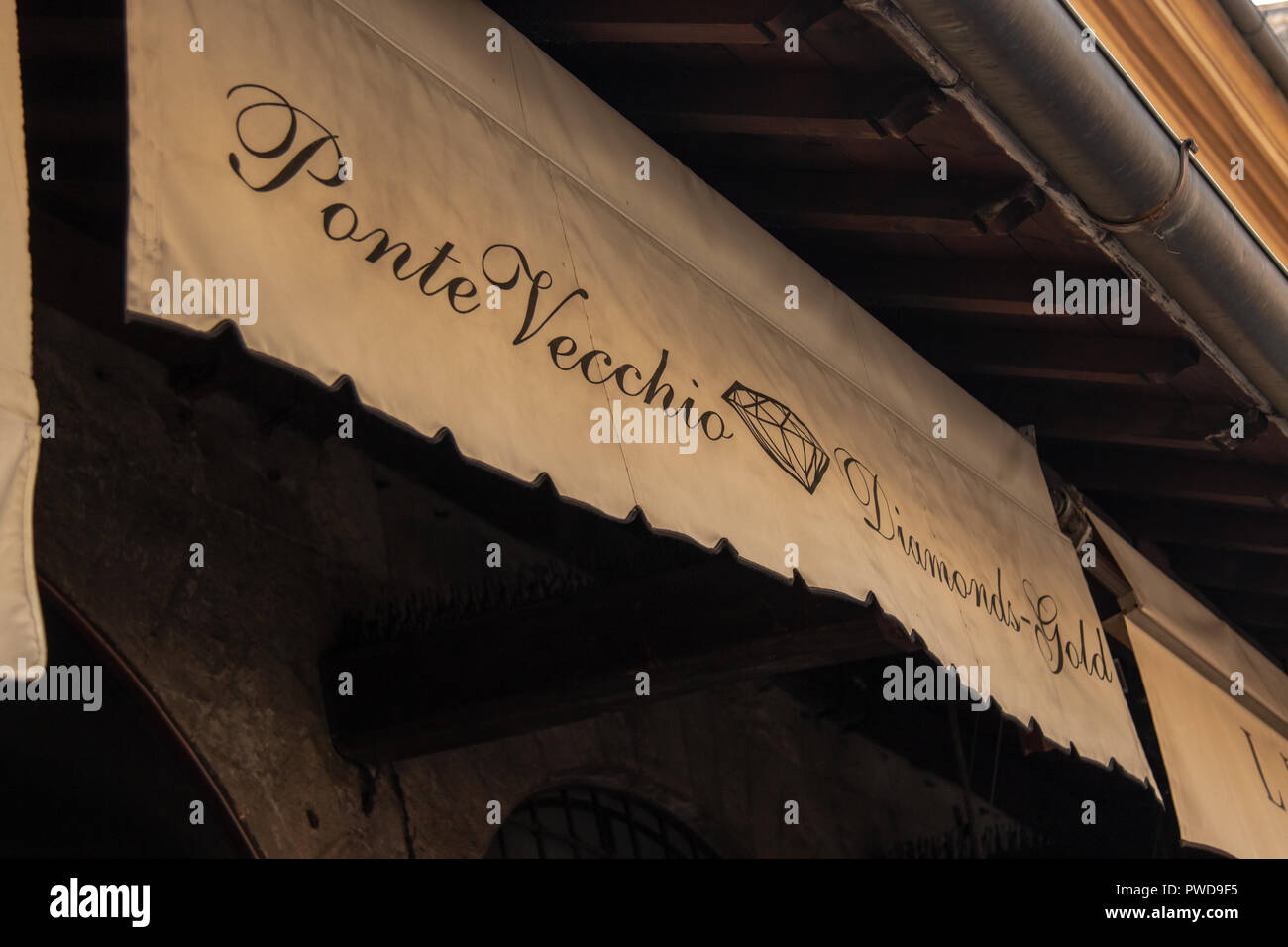 A sign on a diamond and gold shop on the Ponte Vecchio, Florence, Italy ...