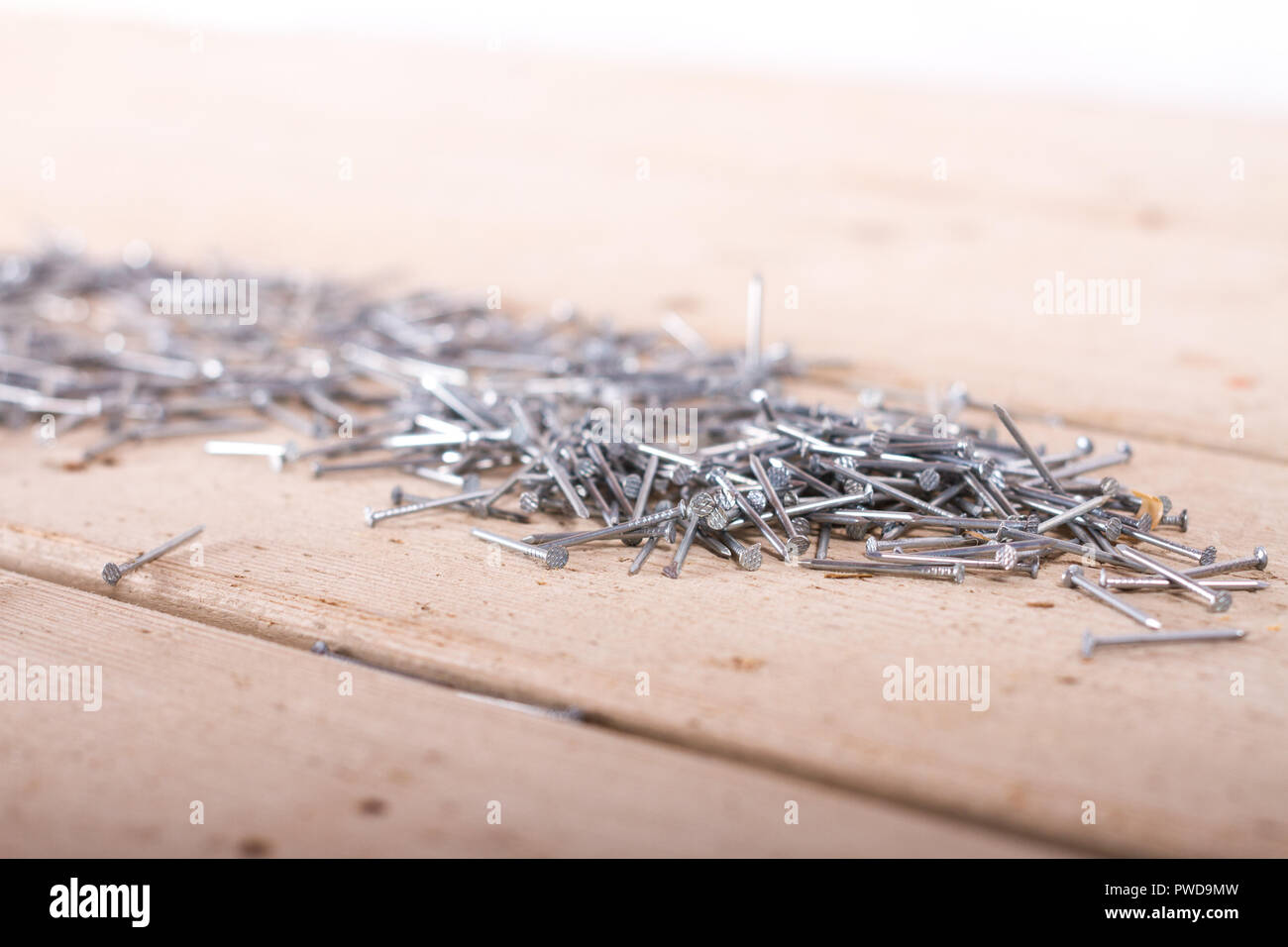 wooden hardware nails on rough surface Stock Photo - Alamy