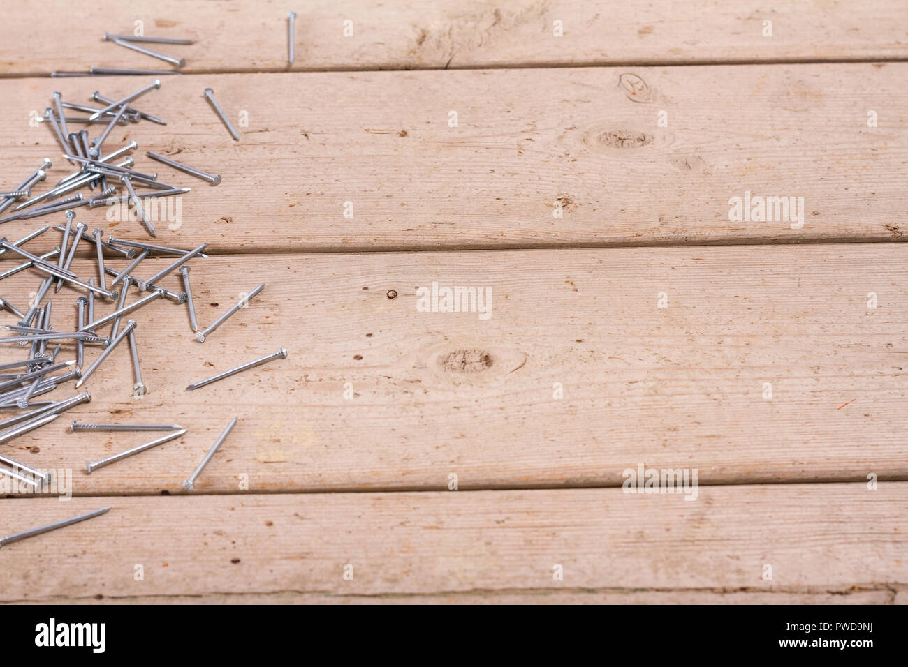 wooden hardware nails on rough surface Stock Photo - Alamy