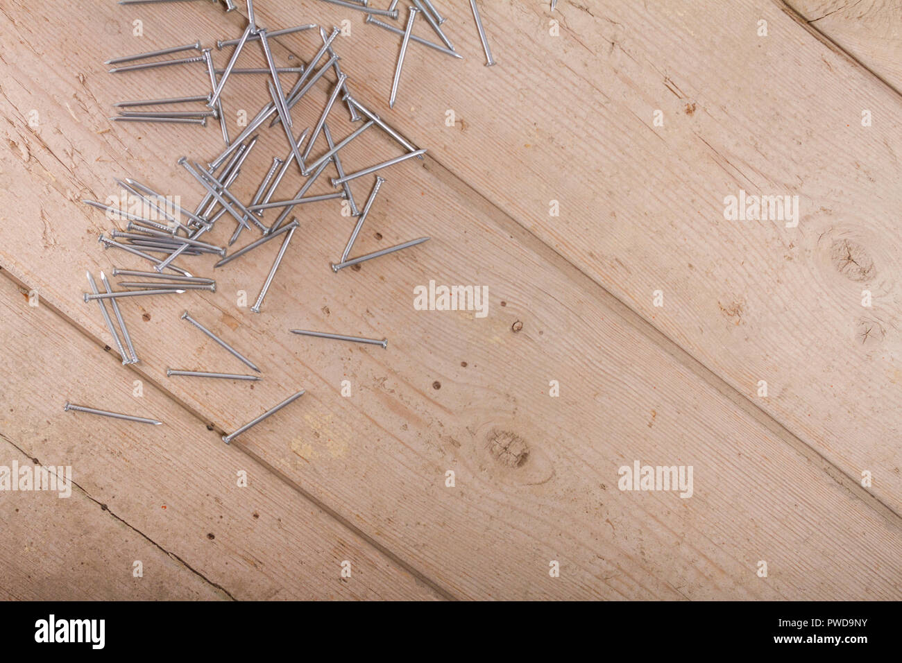 wooden hardware nails on rough surface Stock Photo - Alamy