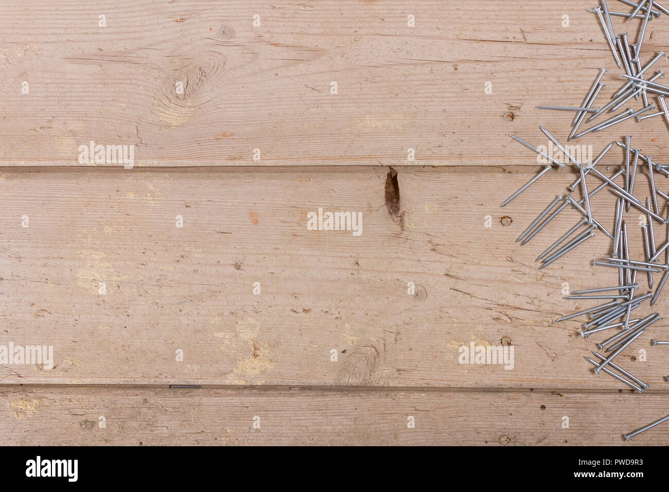 wooden hardware nails on rough surface Stock Photo - Alamy