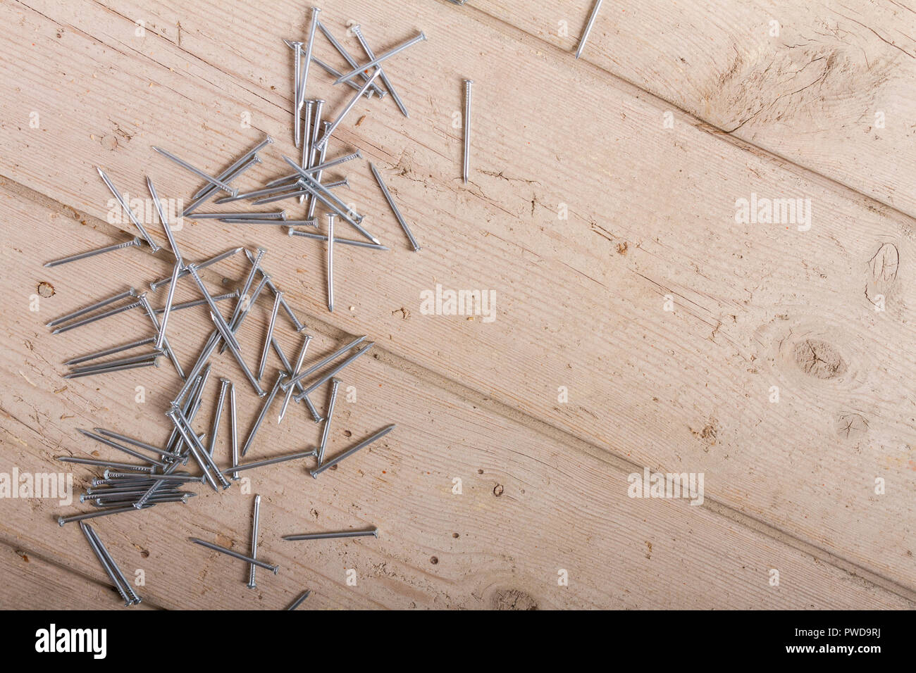 wooden hardware nails on rough surface Stock Photo - Alamy