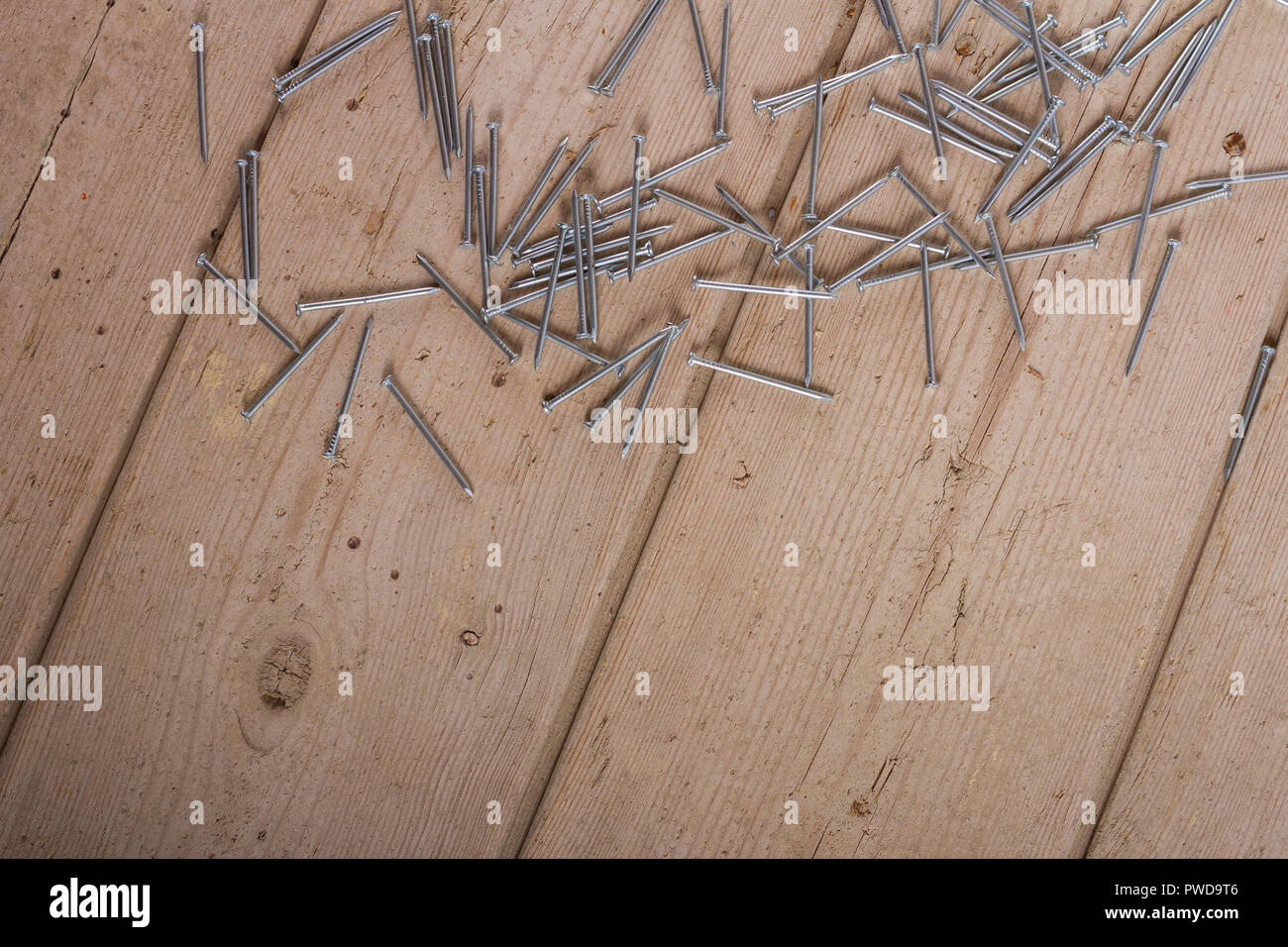 wooden hardware nails on rough surface Stock Photo - Alamy