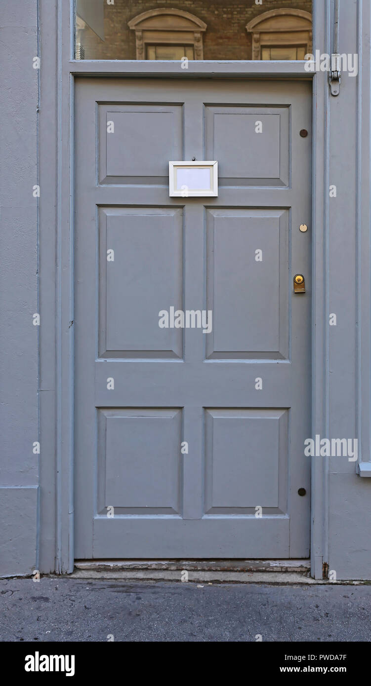 Grey Door With Smal Frame Entrance in London Stock Photo - Alamy