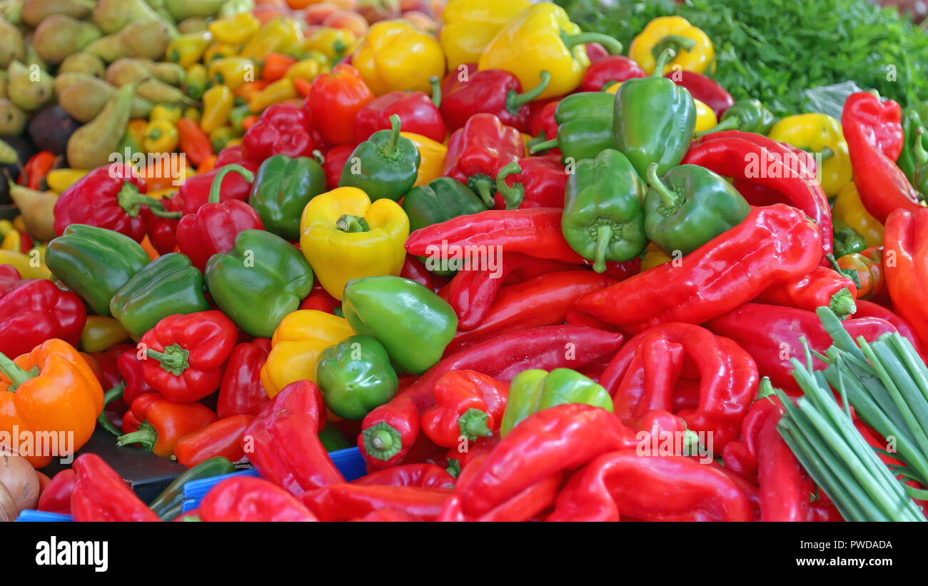 Big Bunch of Various Colorful Peppers at Farmers Market Stock Photo - Alamy
