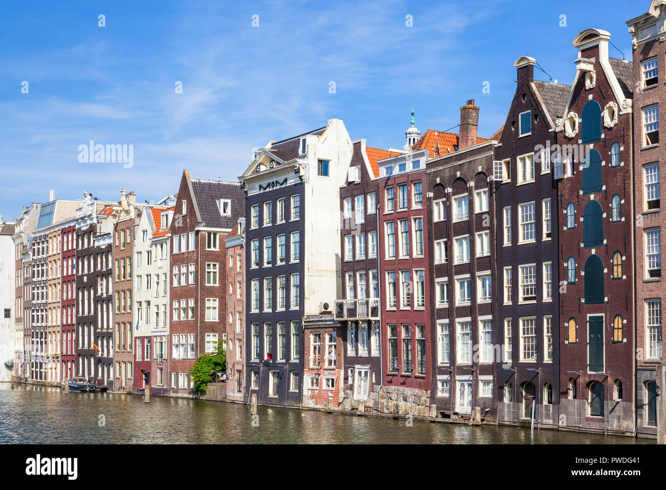 Amsterdam houses on Damrak a partially filled in canal dancing houses ...