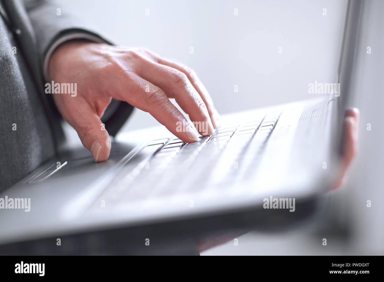 close up.hand businessman on laptop keyboard.isolated on blurred Stock ...