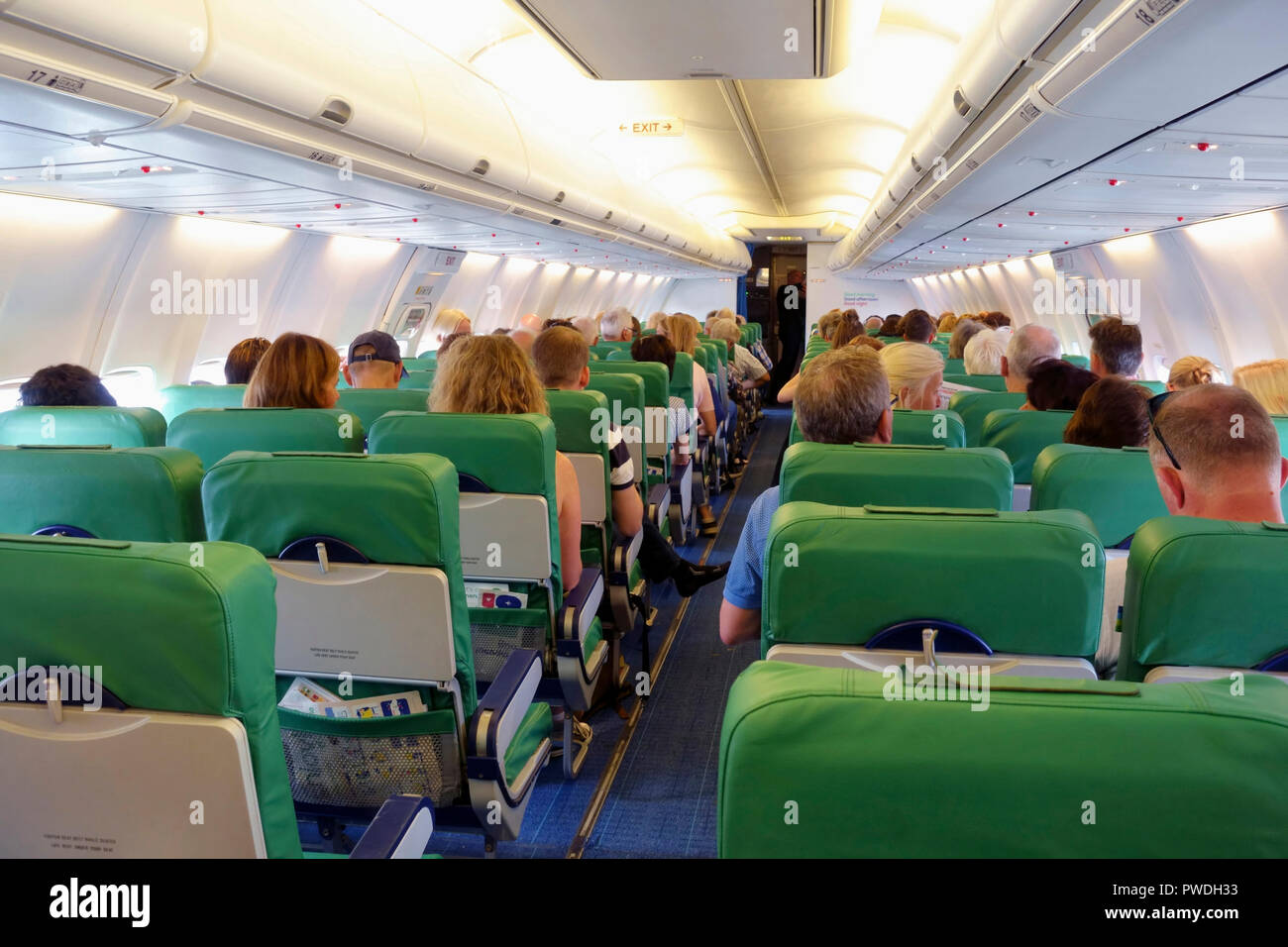 Airplane cabin interior exit sign hi-res stock photography and images ...