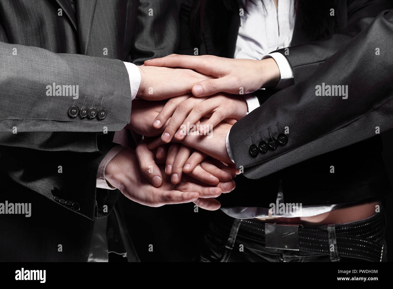 close up.a group of business people folded their hands together Stock ...