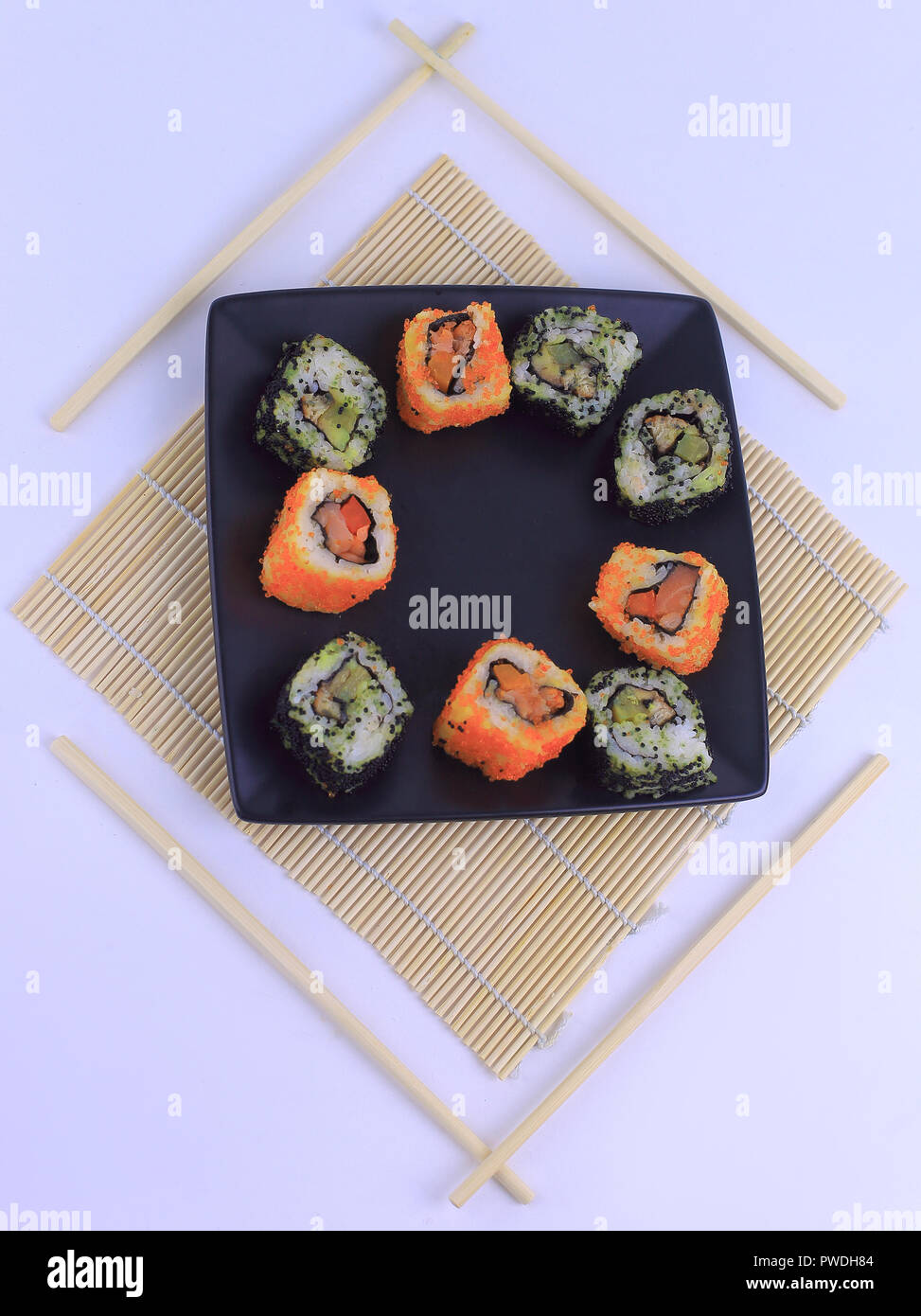 different types of Maki sushi on a black plate Stock Photo - Alamy