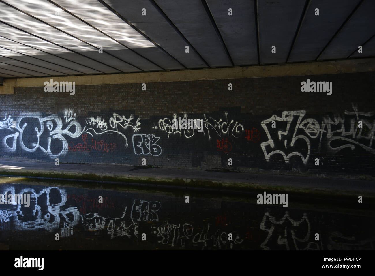 Canalside graffiti on the underside of bridge taking Ladywood Middleway ...