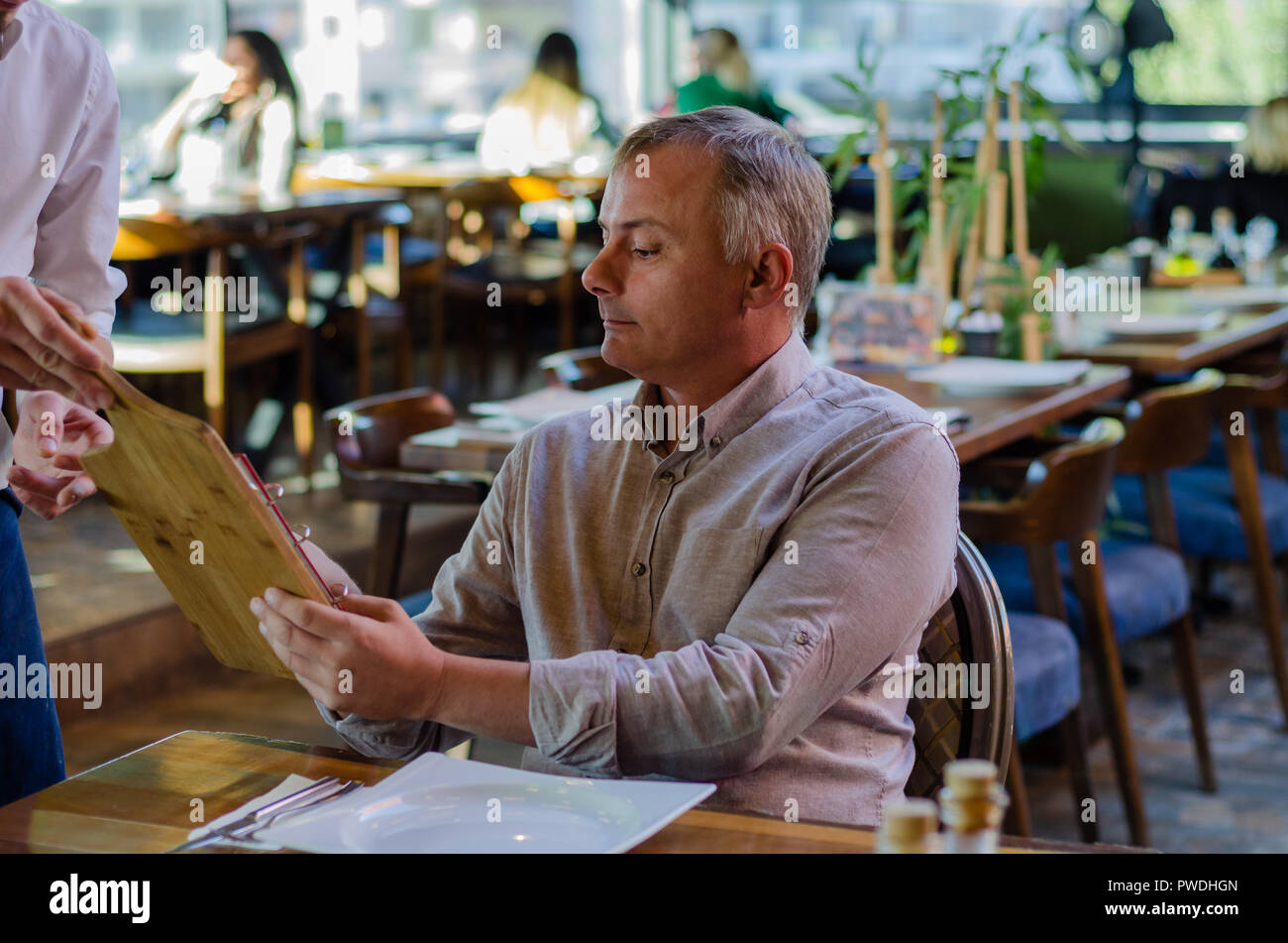 Man giving an order hi-res stock photography and images - Alamy