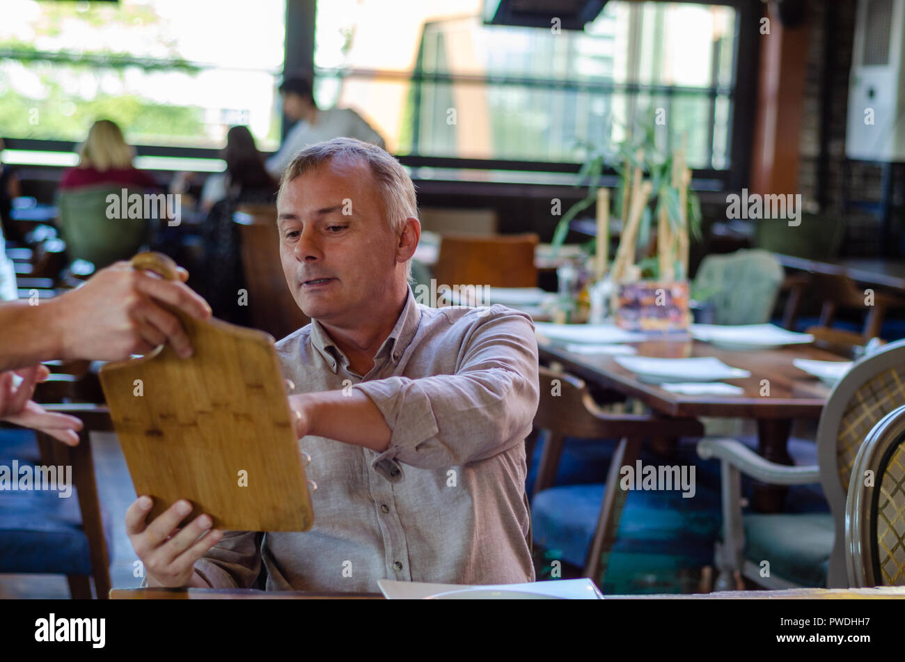 Man giving an order hi-res stock photography and images - Alamy
