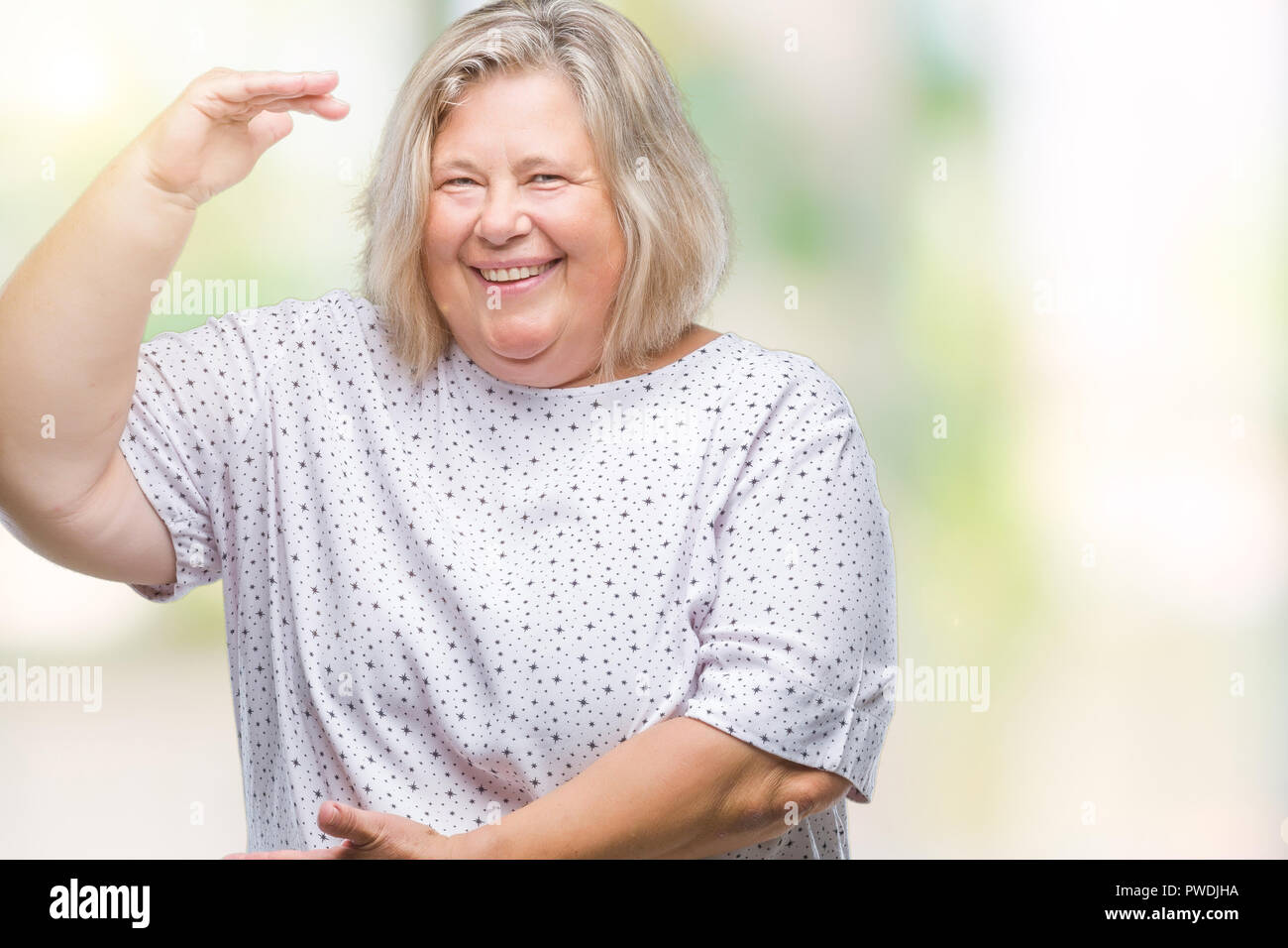 Senior plus size caucasian woman over isolated background gesturing ...