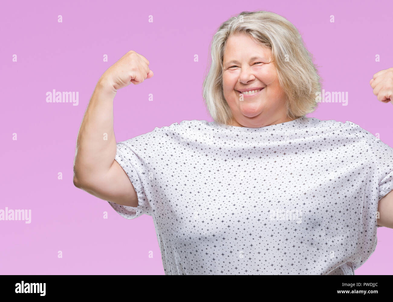 Senior plus size caucasian woman over isolated background showing arms ...