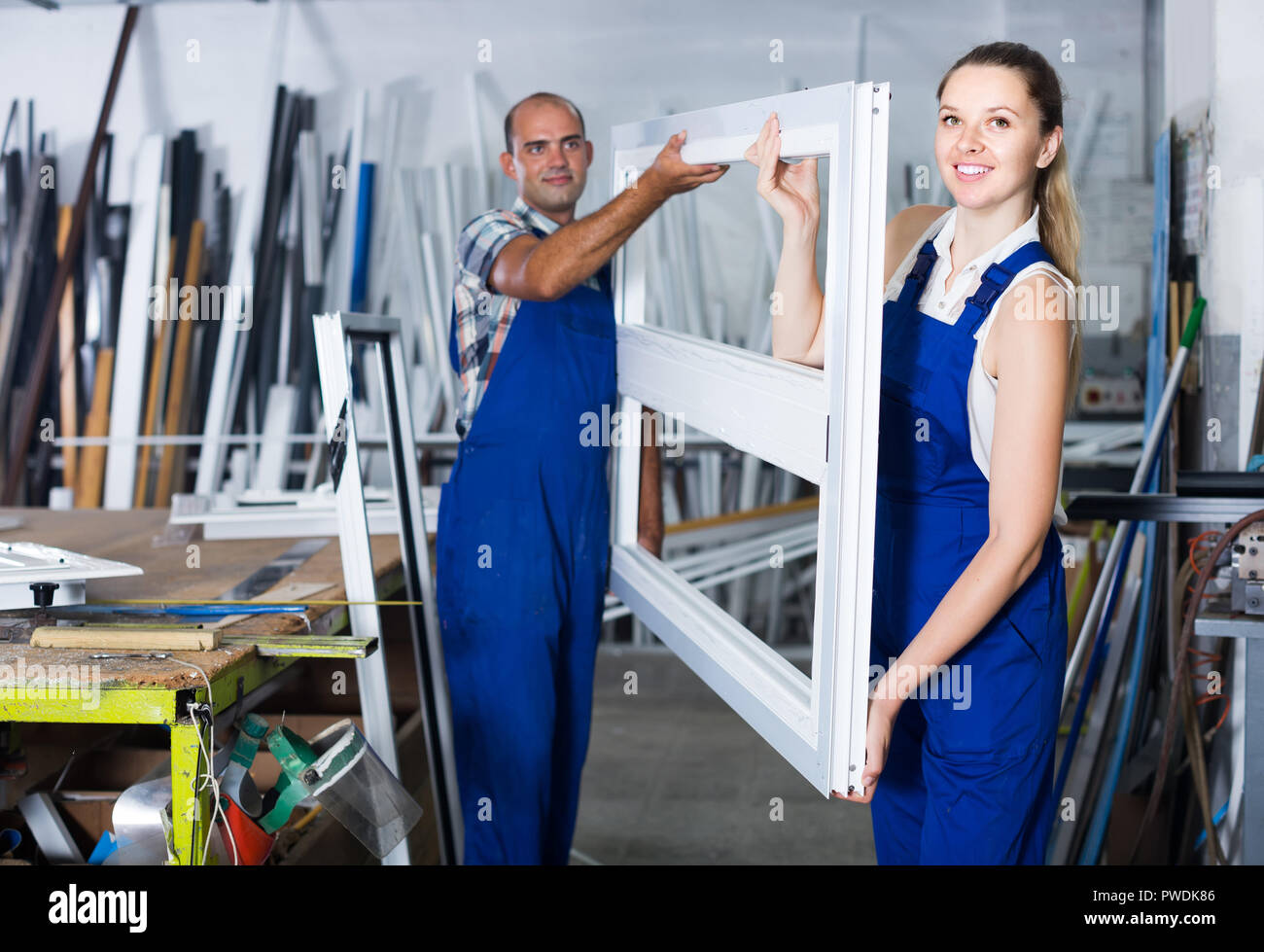 Two germany professional workers working in assembly shop of plastic ...