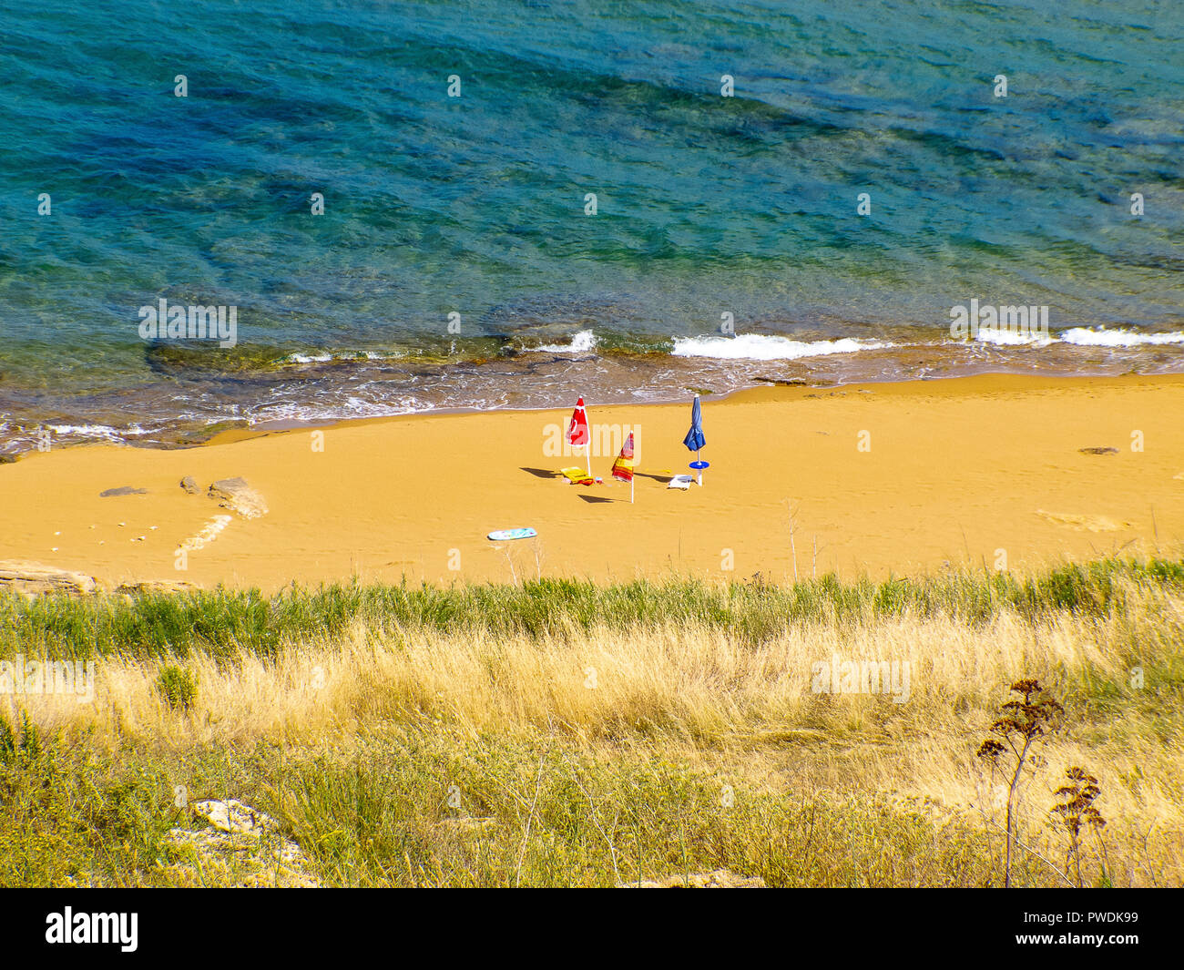 Eastern Italian coast: empty sandy beach, with only three beach ...