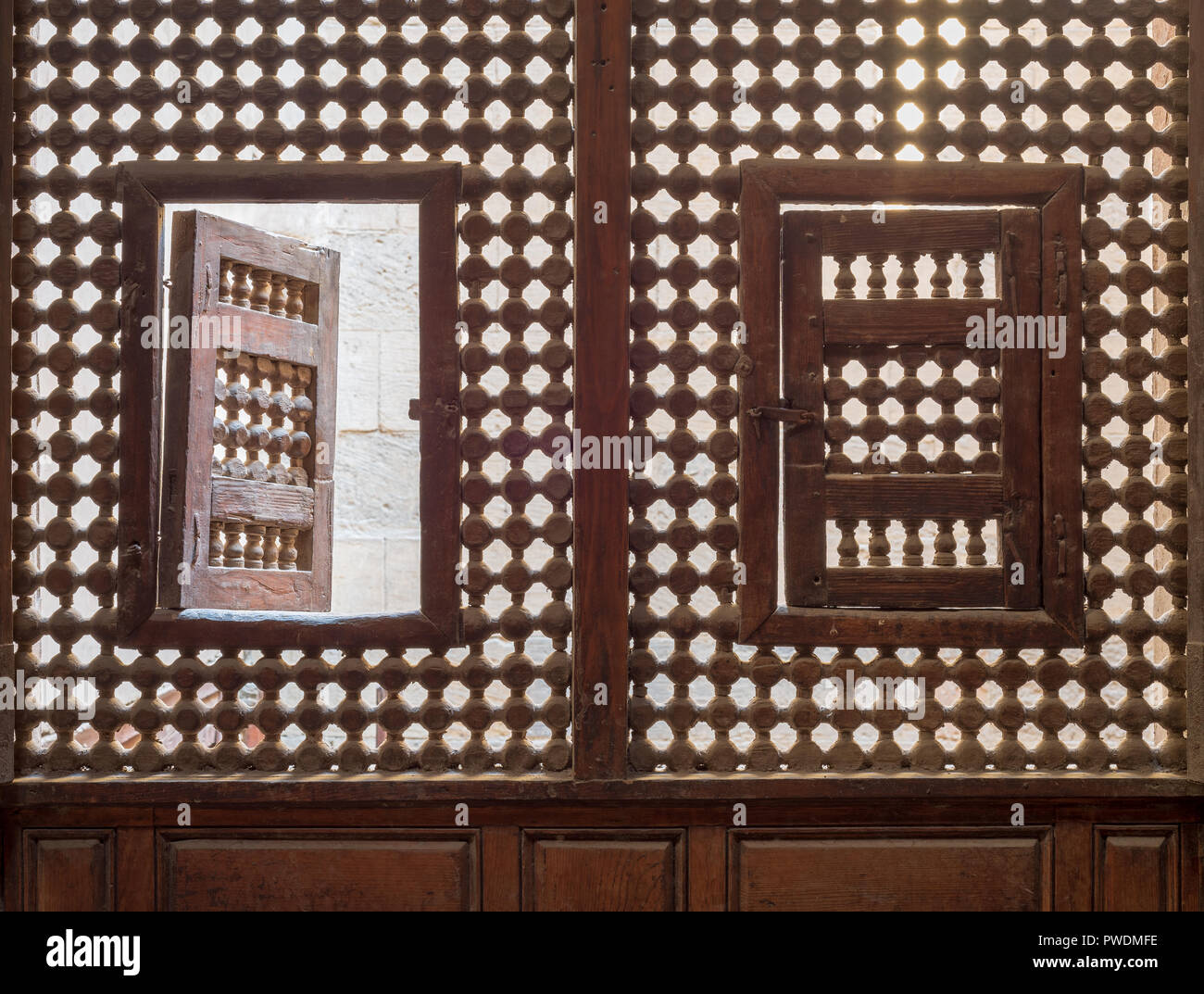 Wooden latticed window (Mashrabiya) with two small swinging sashes ...