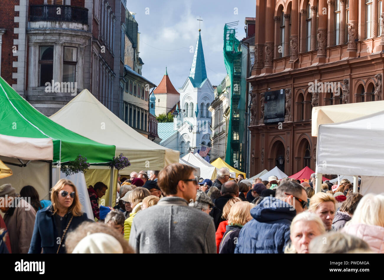 People on Dome Square of Riga, Latvia, during market hours Stock Photo ...
