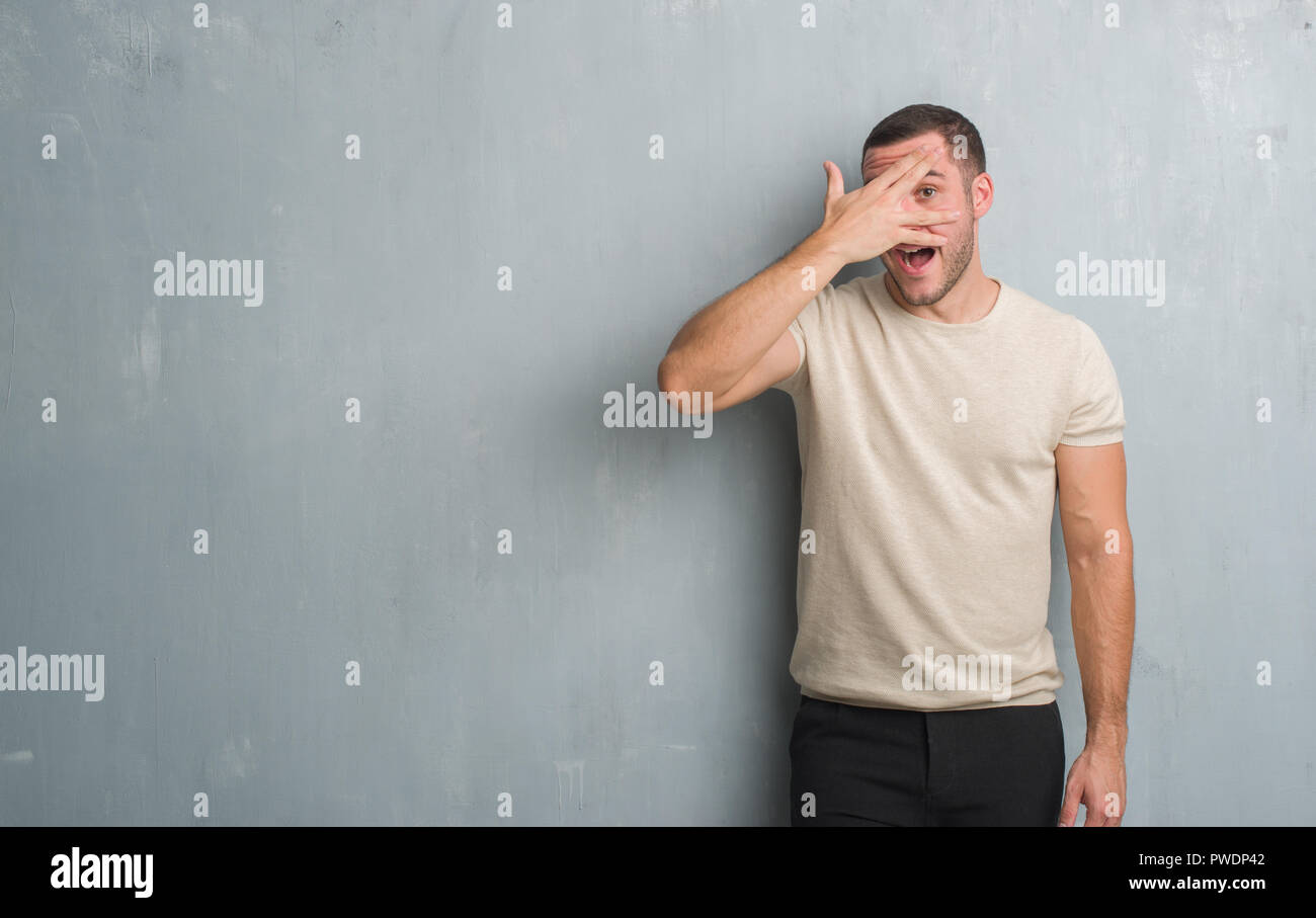 Man peeking over wall hi-res stock photography and images - Alamy