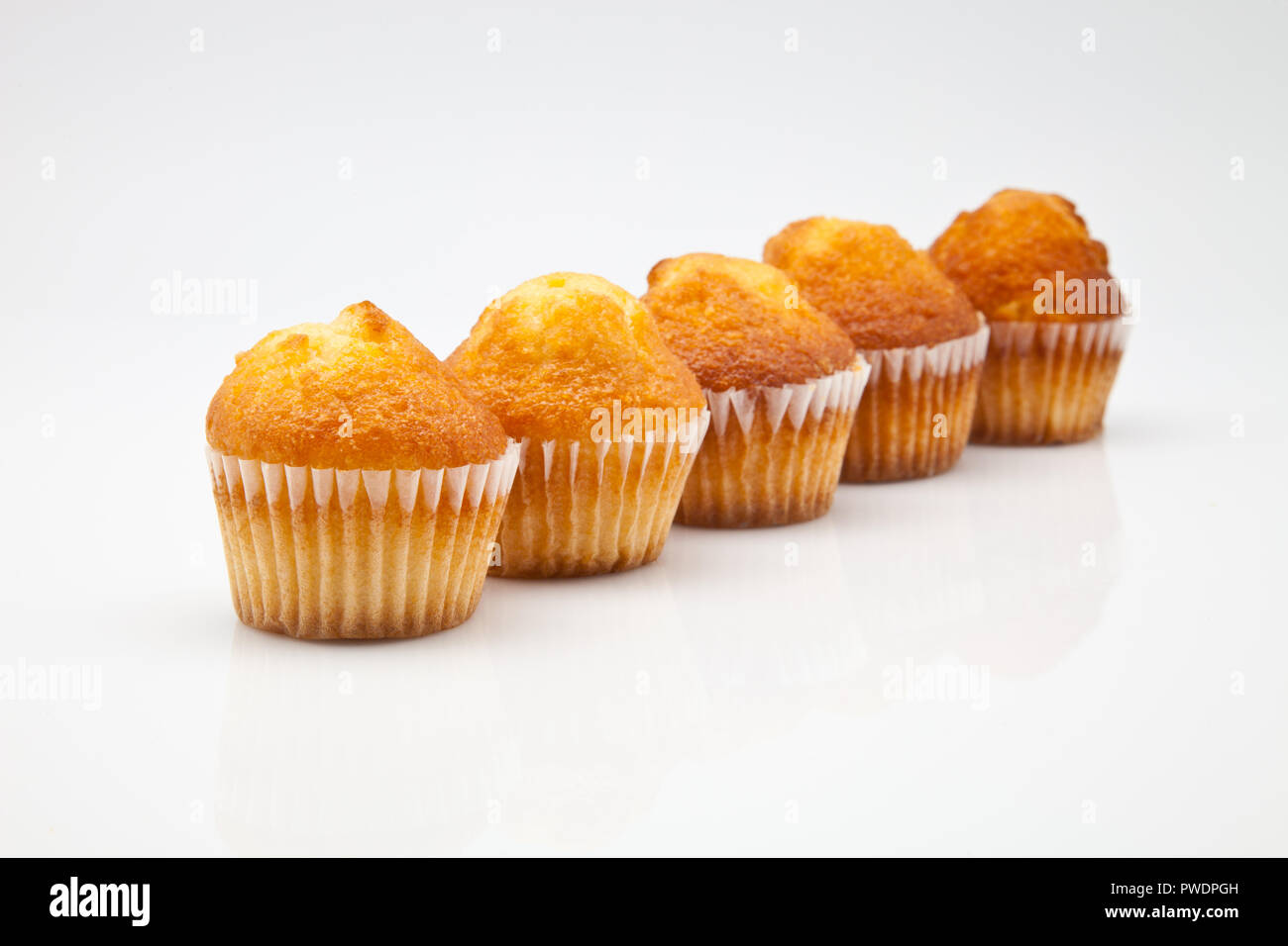 five golden muffins ready to eat Stock Photo - Alamy