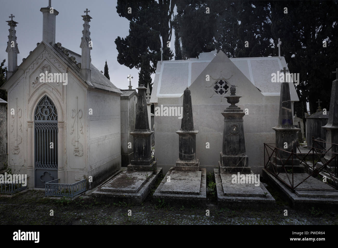 Sad old european cemetery family tombs Stock Photo - Alamy