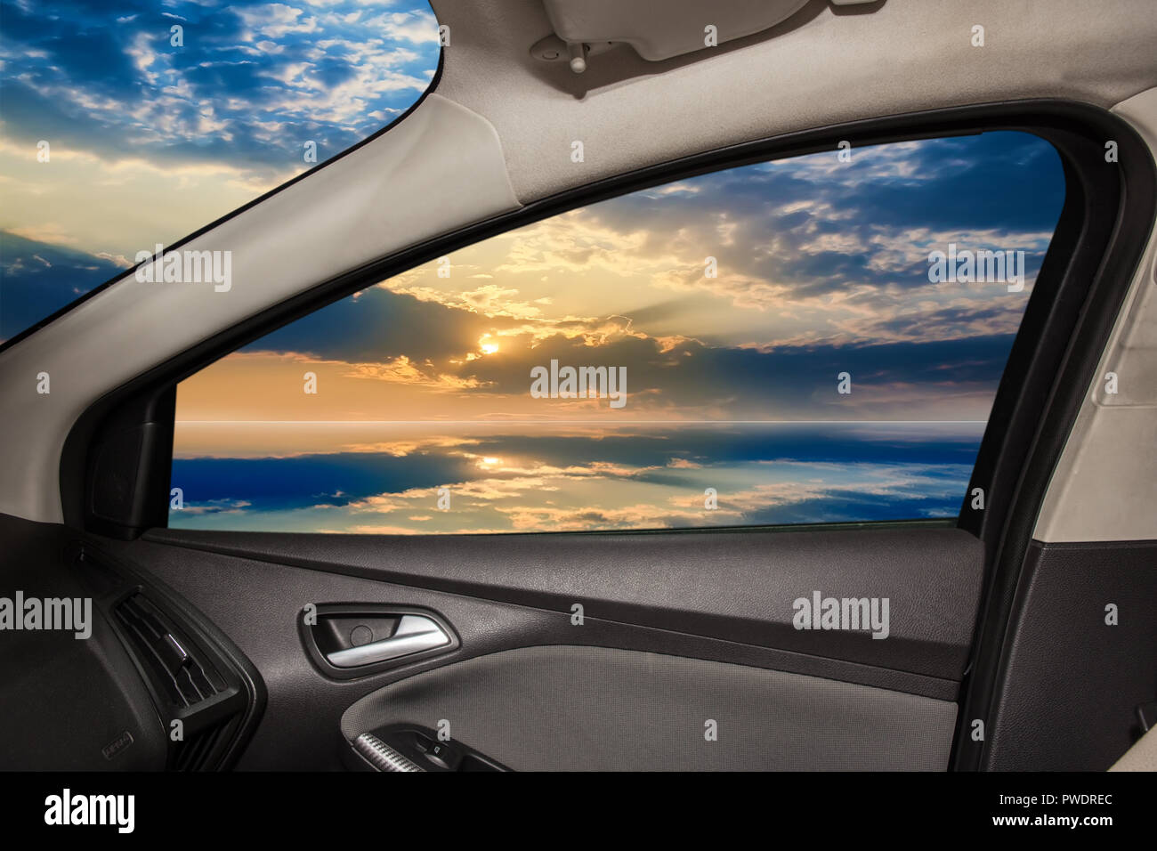Beautiful clouds and water surface from car window Stock Photo - Alamy