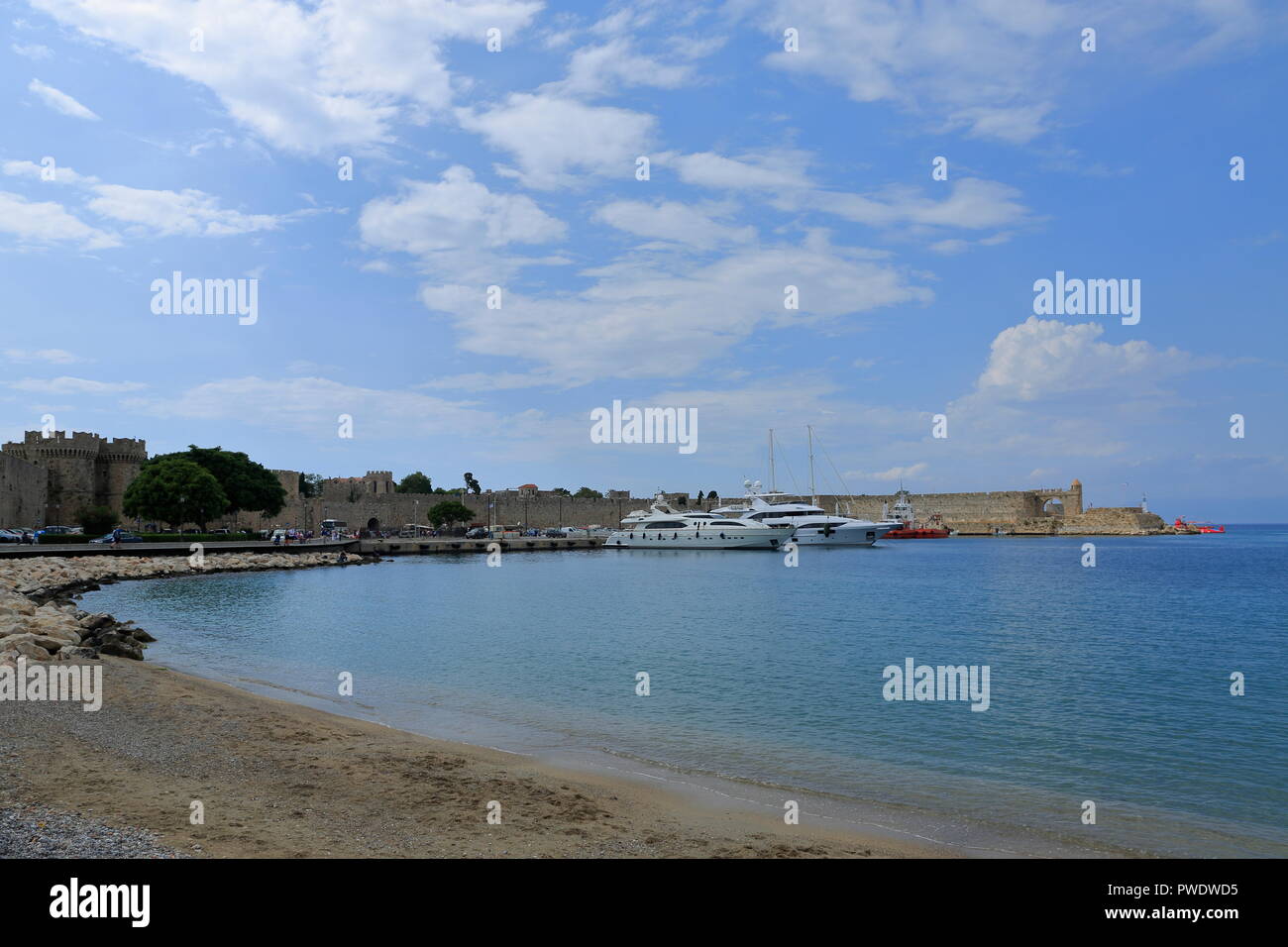 Views of the Mandraki harbor from the island of Rhodes, where the ...