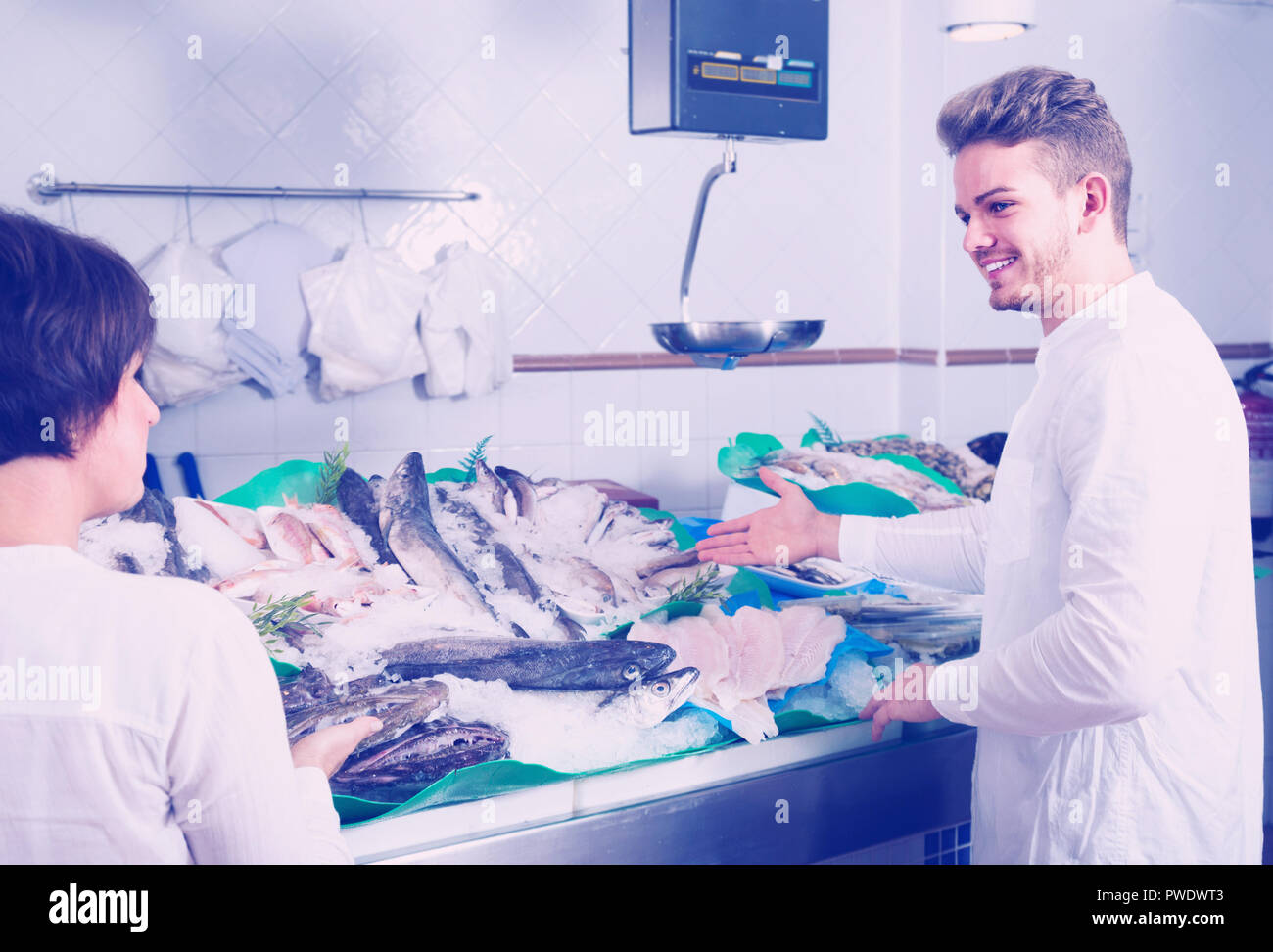 caucasian customers choosing seafood in fish store and smiling Stock ... caucasian customers choosing seafood in fish store and smiling Stock ...
