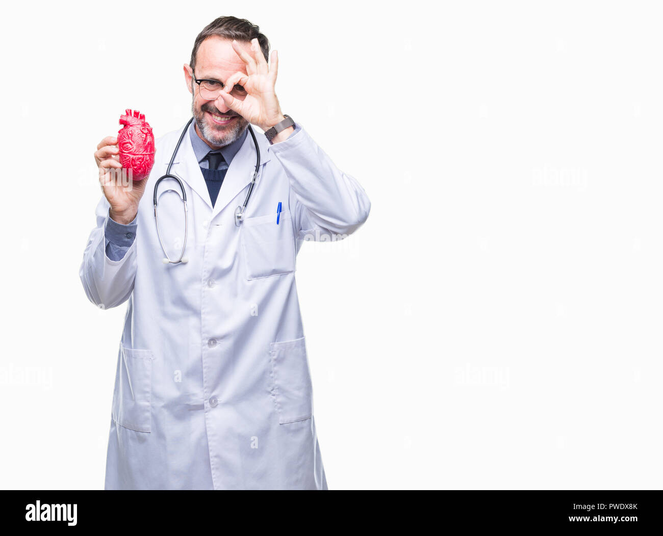 Middle age senior hoary cardiologist doctor man holding heart over ...